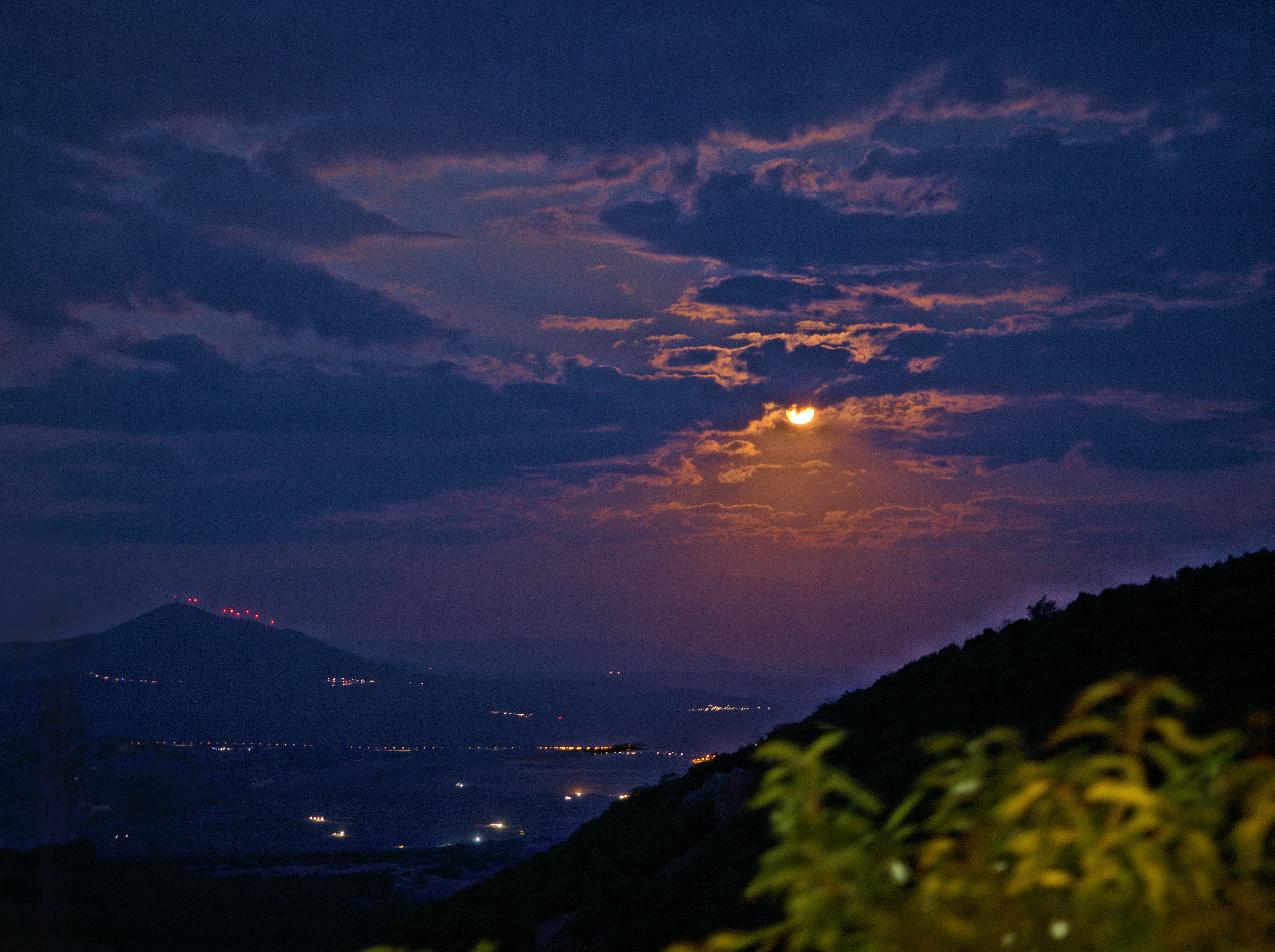 Dusk Over a Quiet Valley: Moonrise Behind the Hill