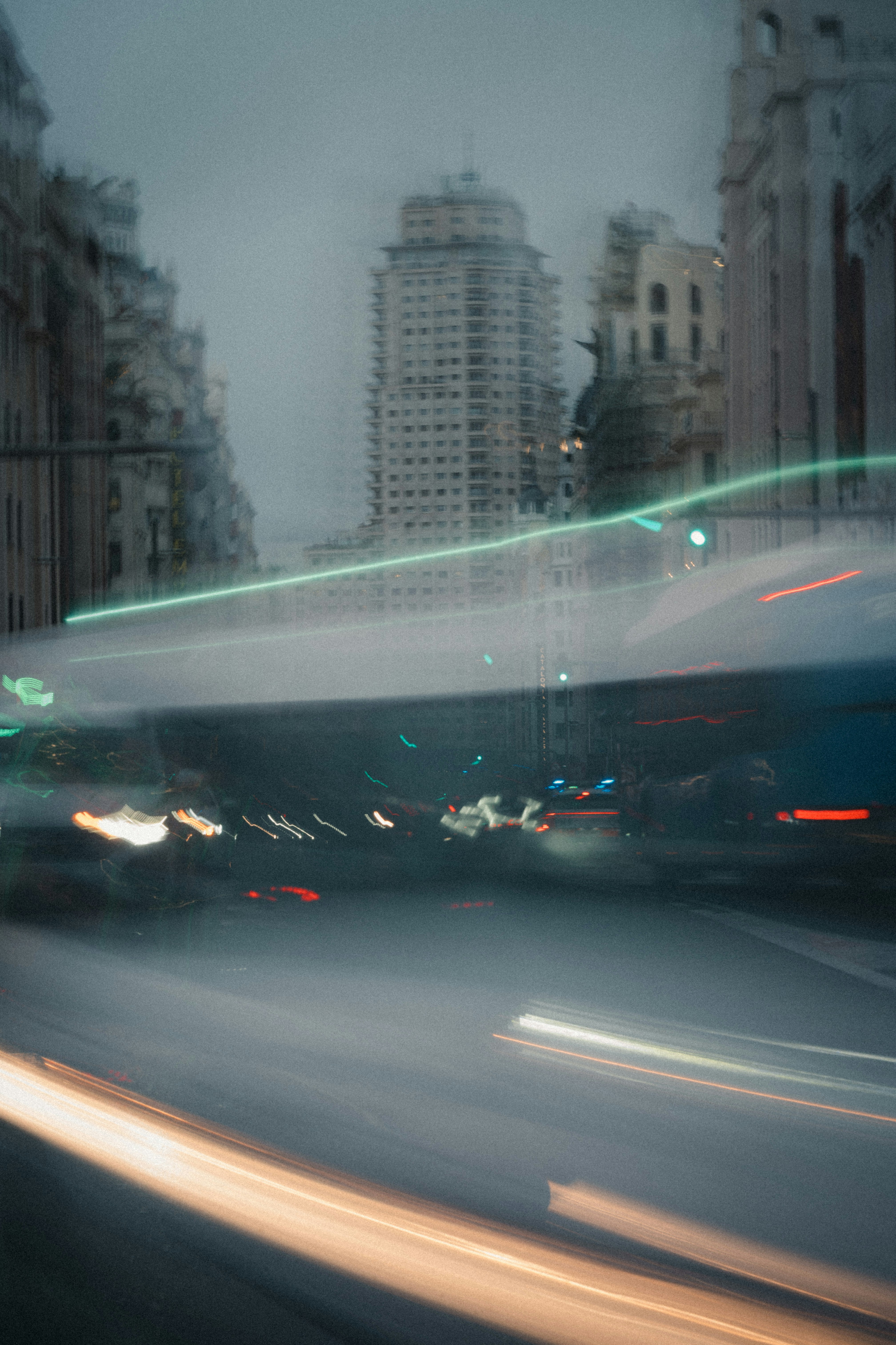 City Rush in Long Exposure: Neon Trails Across a Dusk Avenue