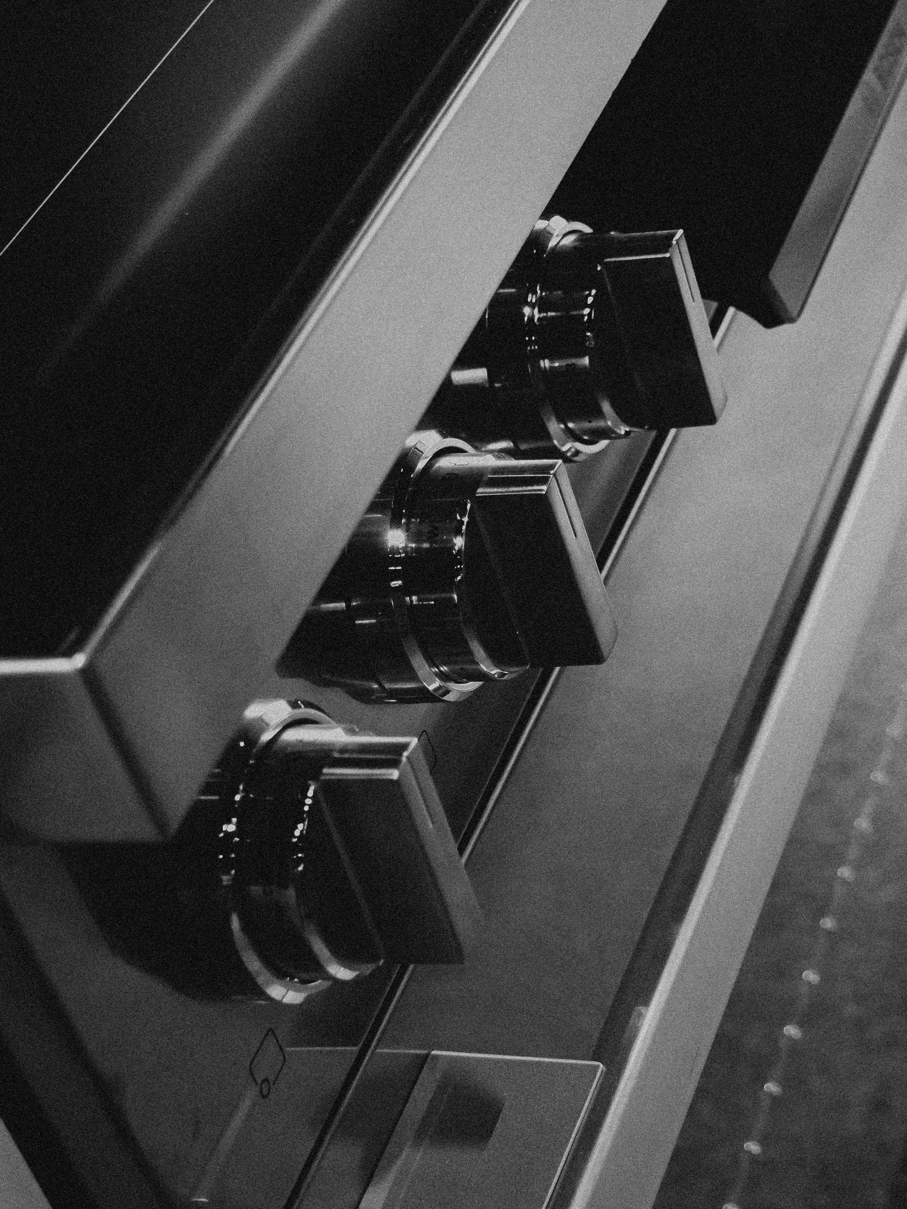 Close-up of a modern oven's control knobs