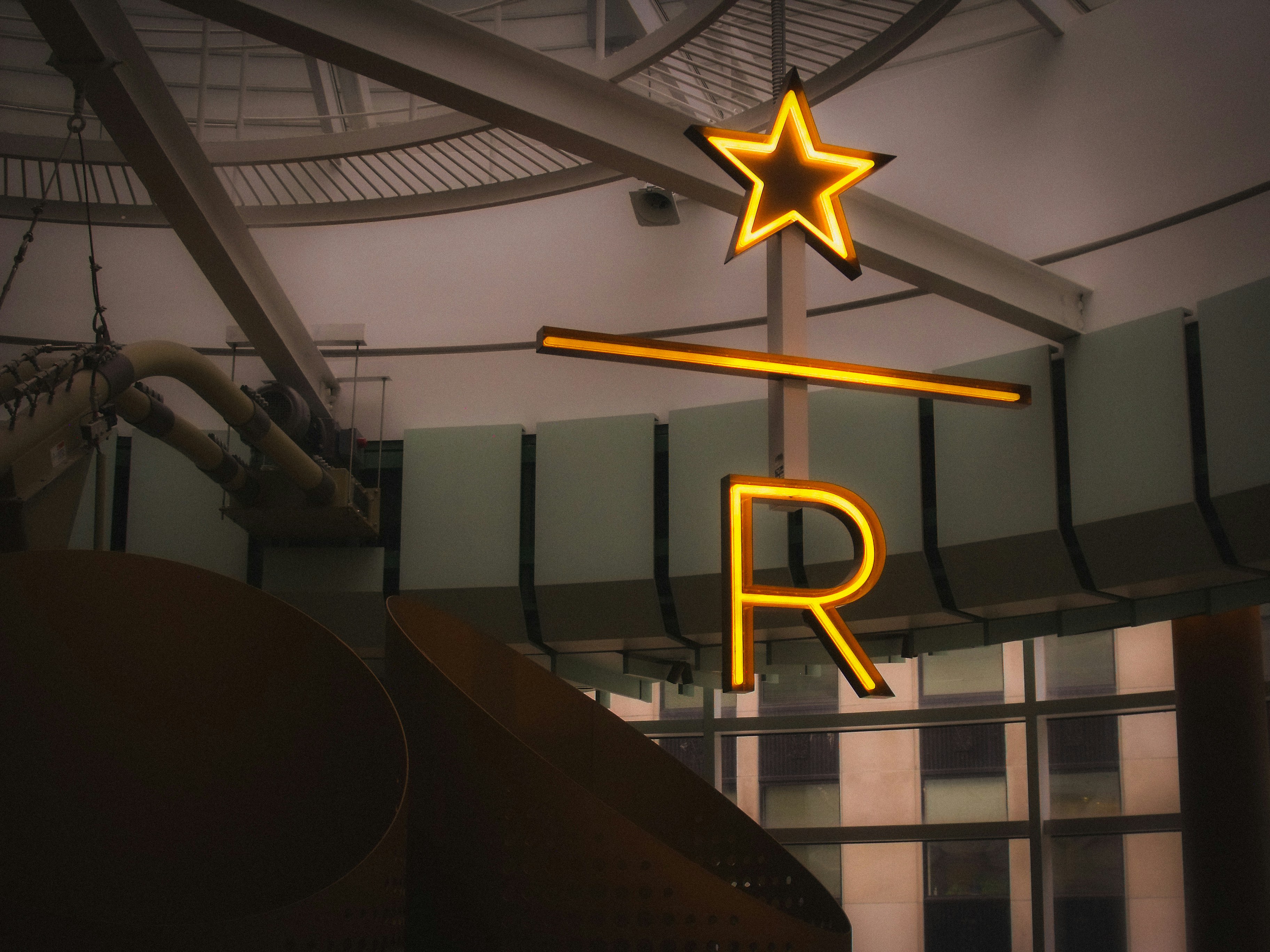 Neon star and letter r sign indoors
