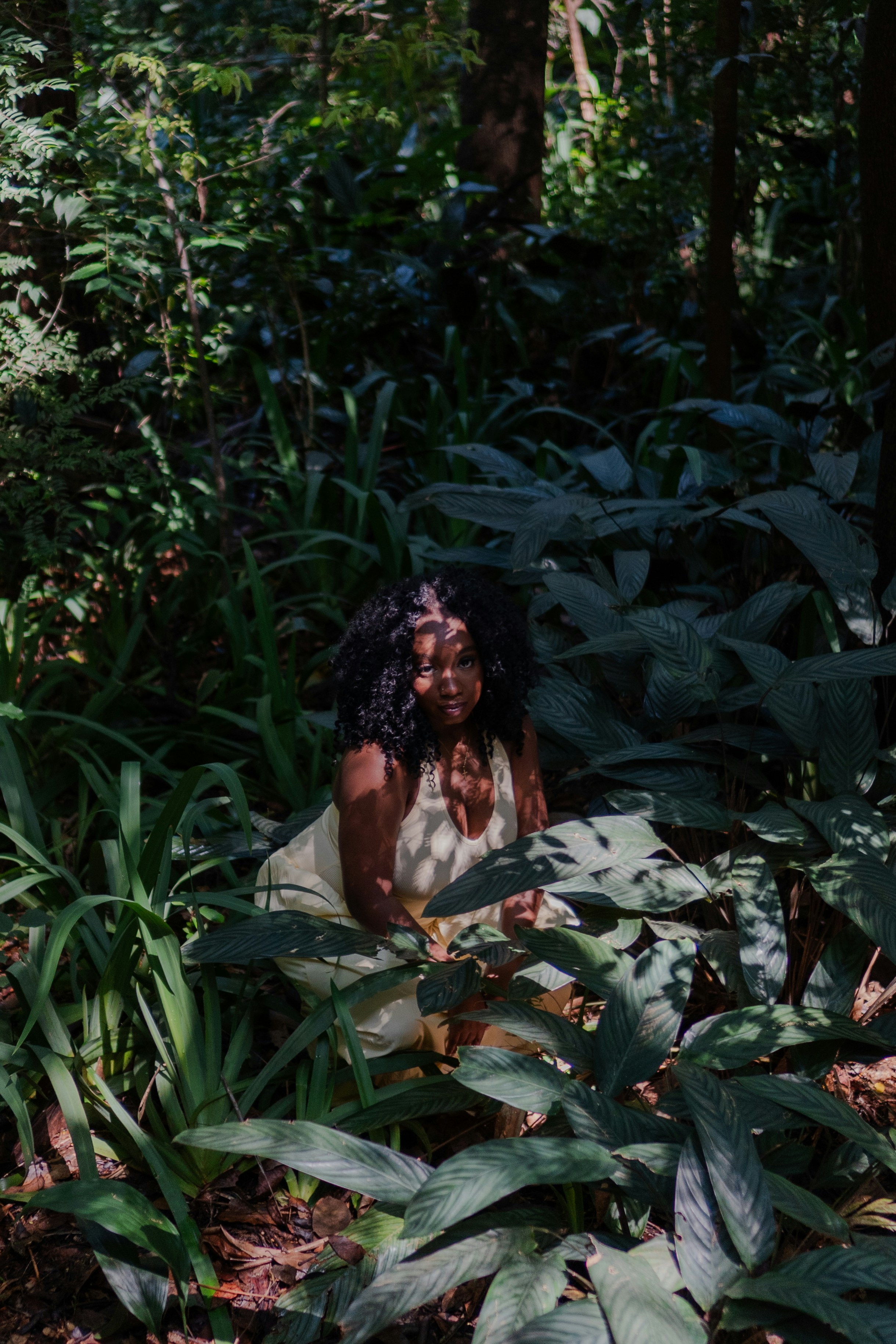 Hidden in the Green: Portrait of Quiet Strength Amidst Jungle Foliage