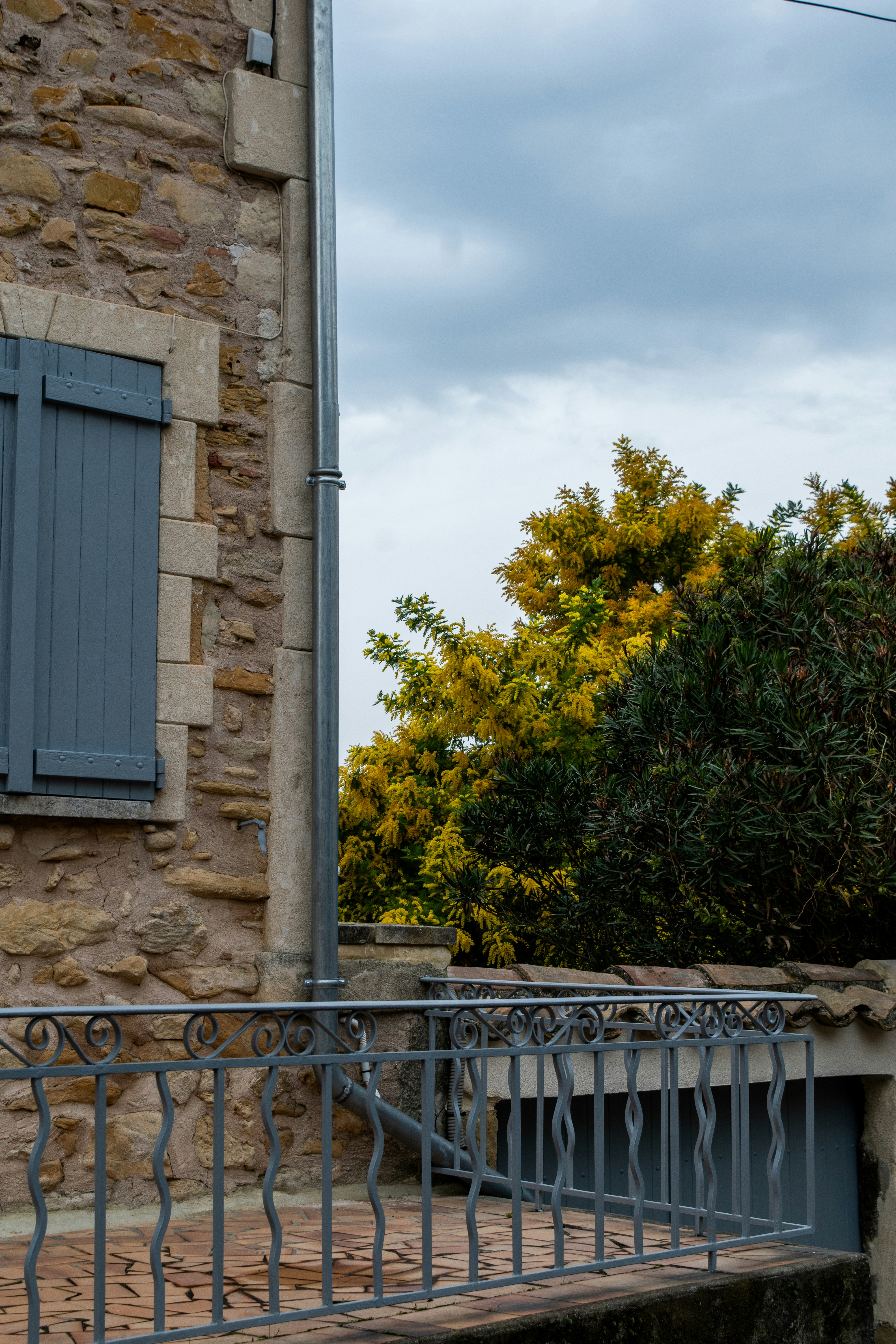 Rusted Balcony Overlooking Autumnal Foliage