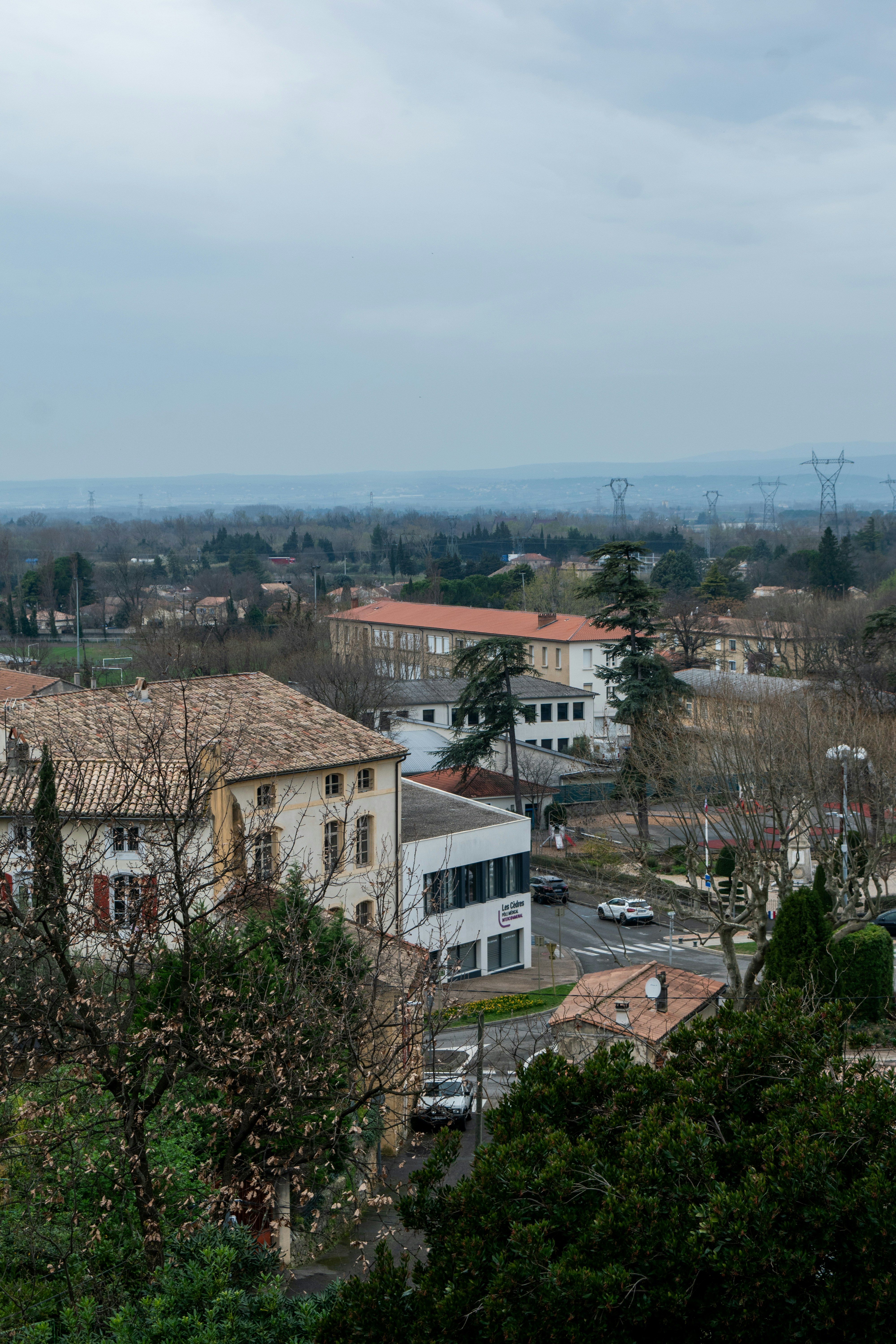 Rooftop Corridor: A Quiet Town Beneath Overcast Skies