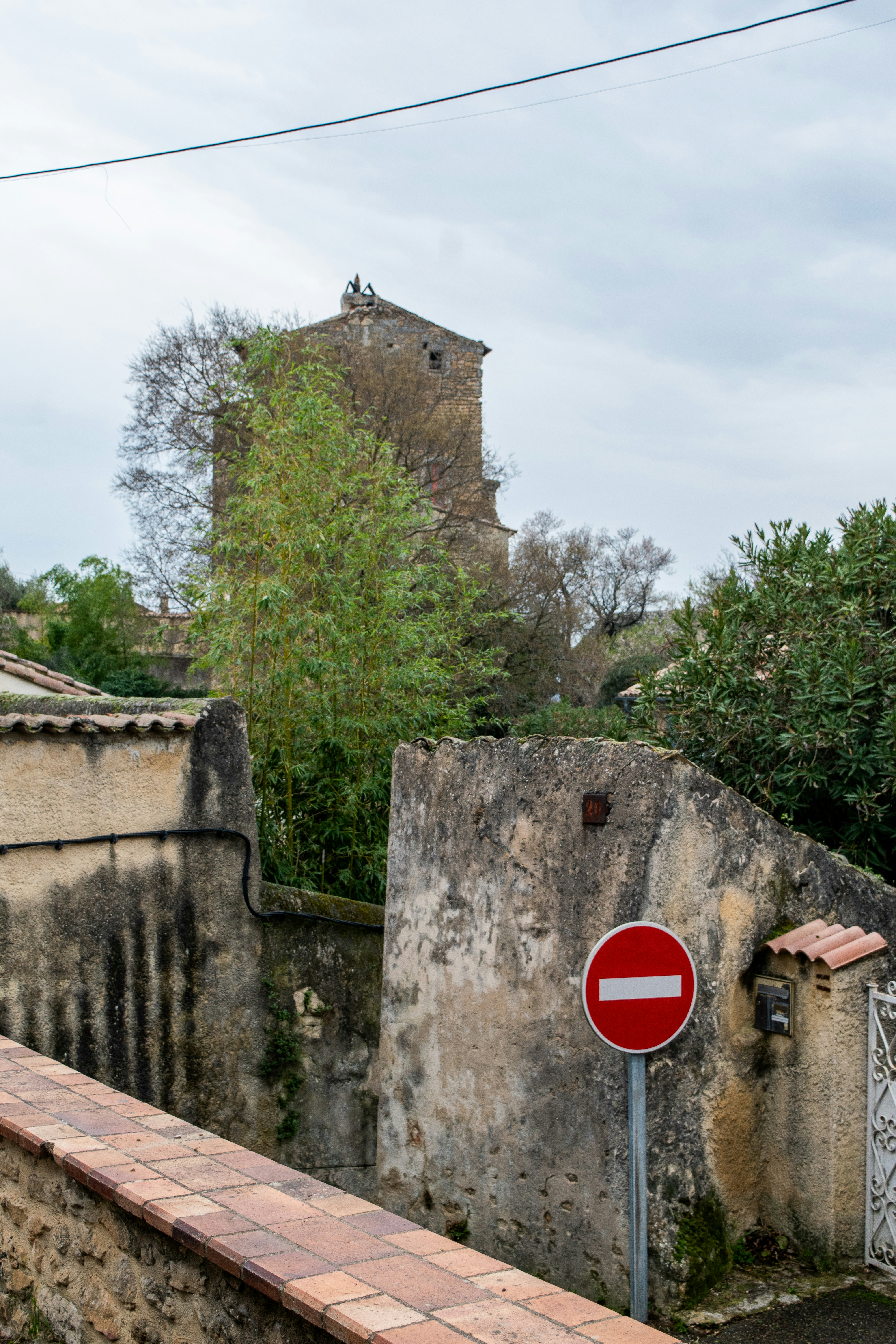 Old Village Tower Rising Over Weathered Walls