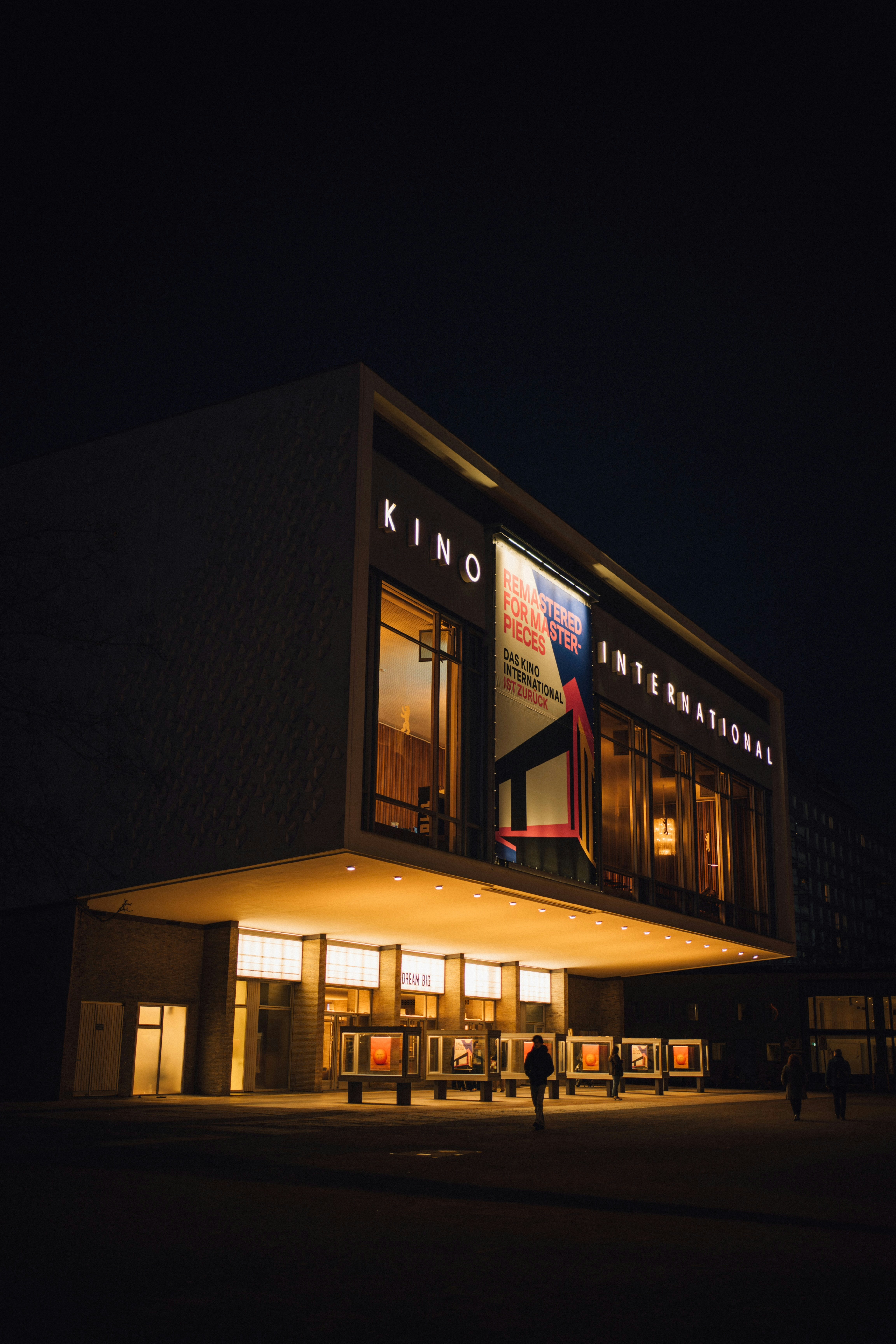 Night Glow at the Grand Cinema: Warm Facade Under Streetlights