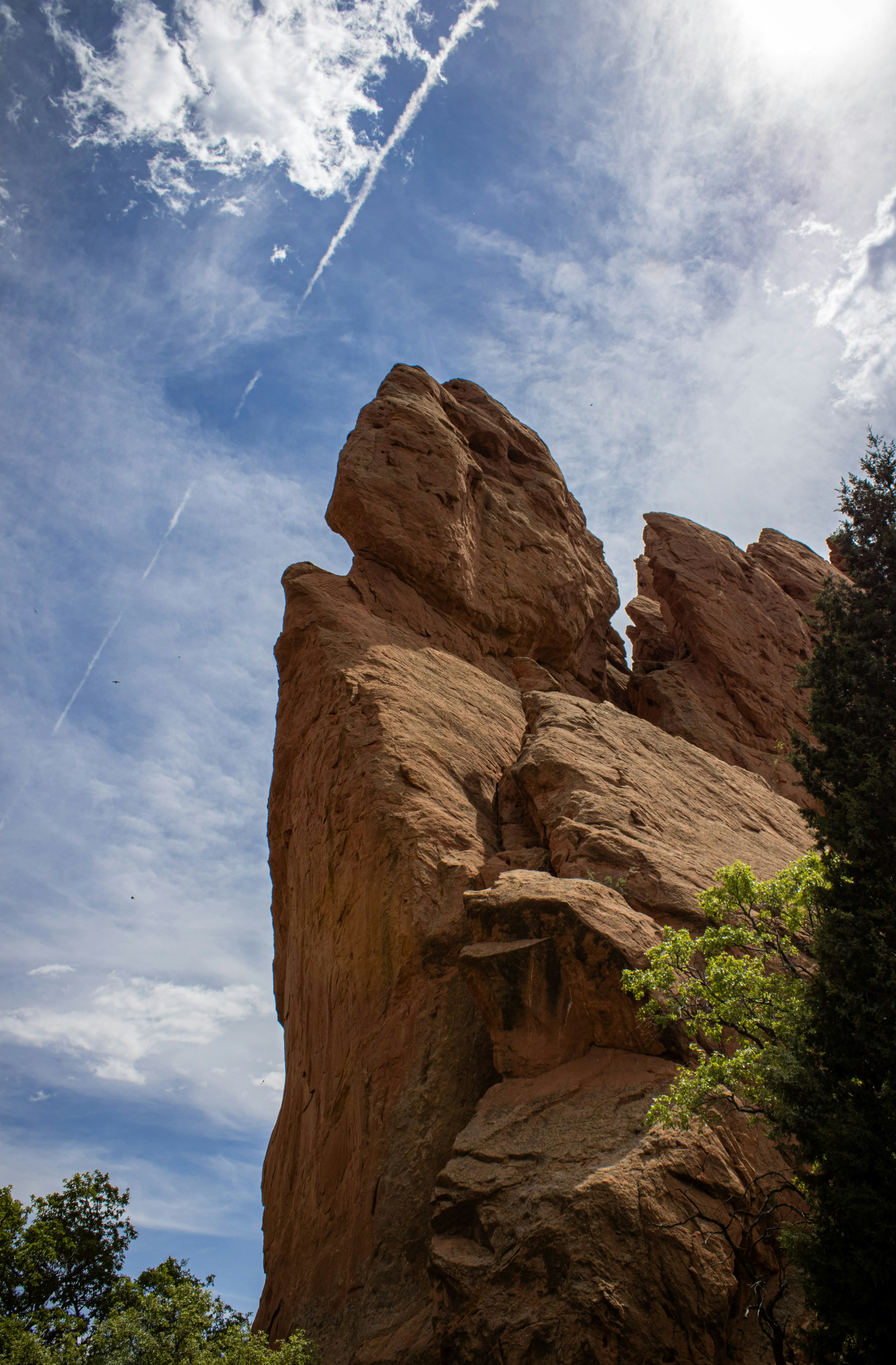 Red Sentinel at Dusk: A Monumental Cliff Against a Vast Sky