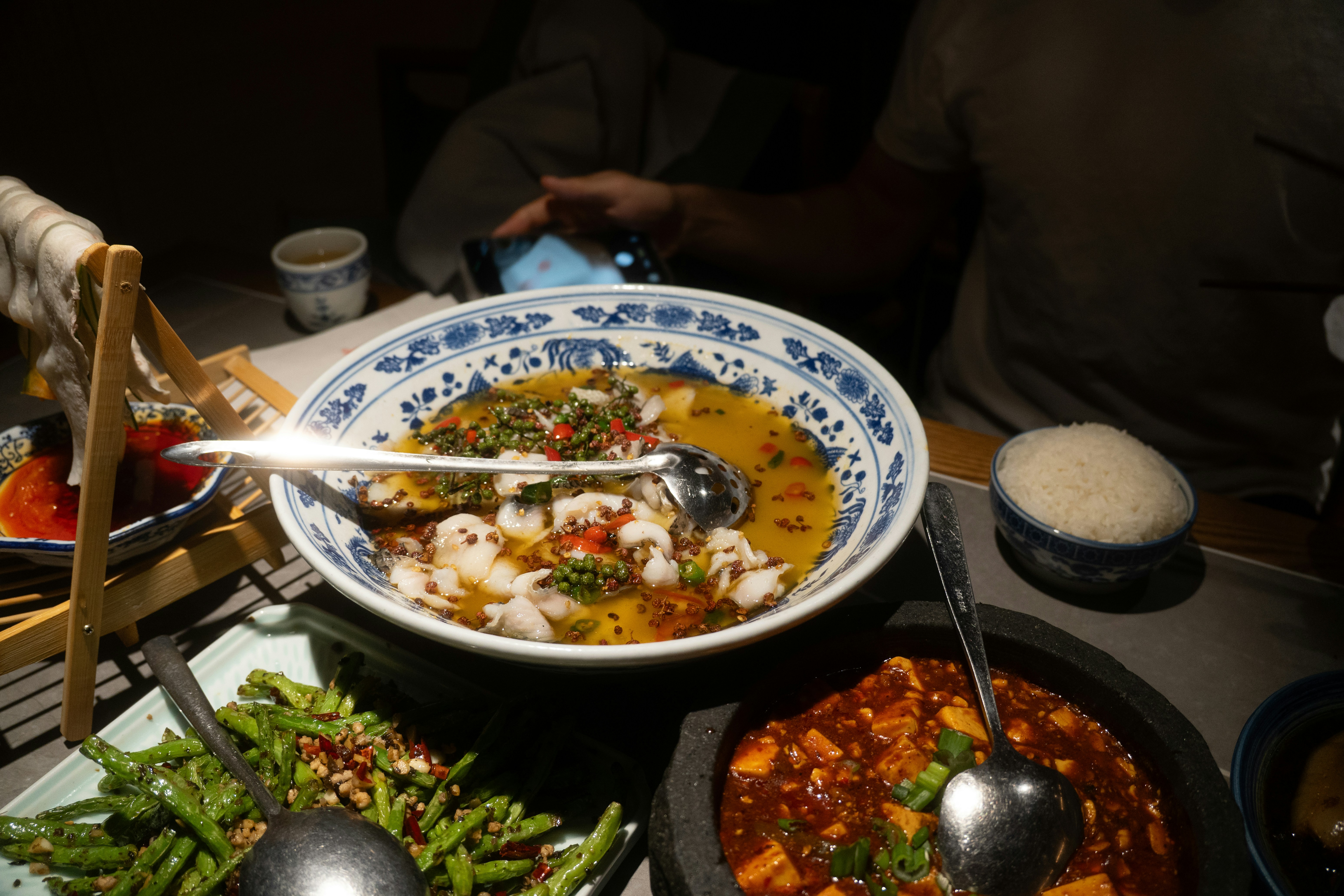 A table full of delicious chinese food dishes.