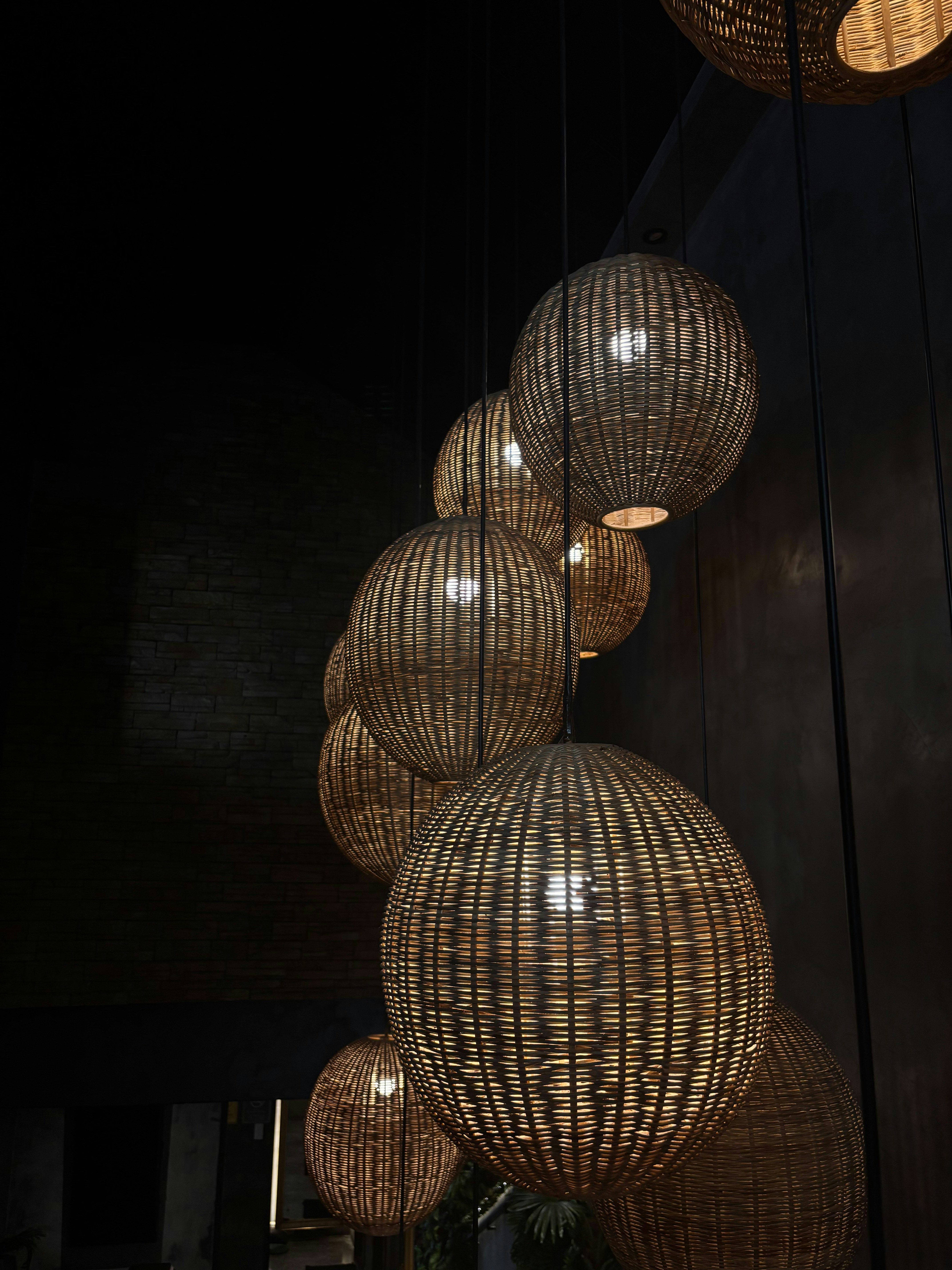 Luminous Orbs: A Cascade of Woven Lanterns in Dim Ambient Light