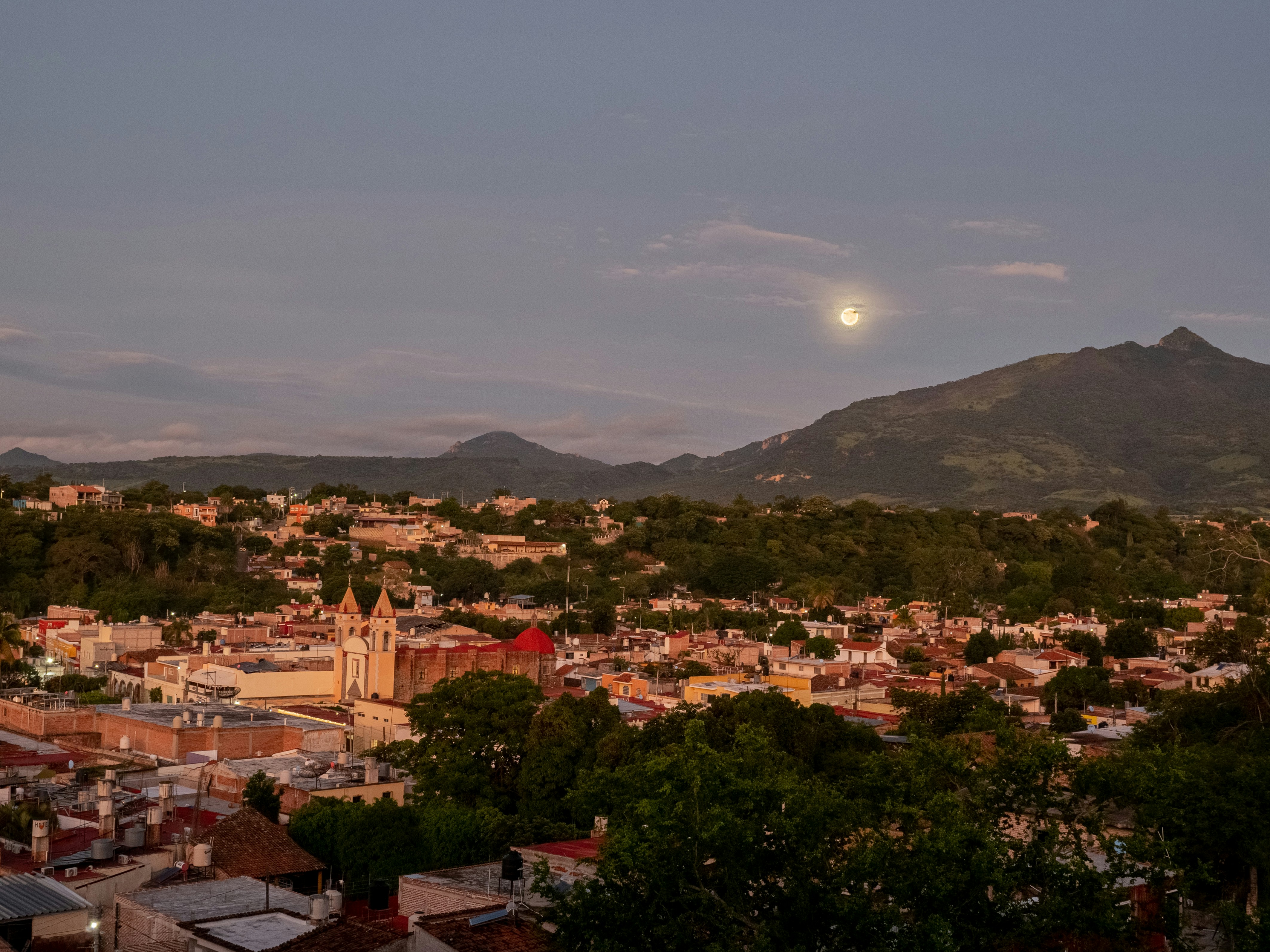 Moonrise Over a Sunlit Pueblo