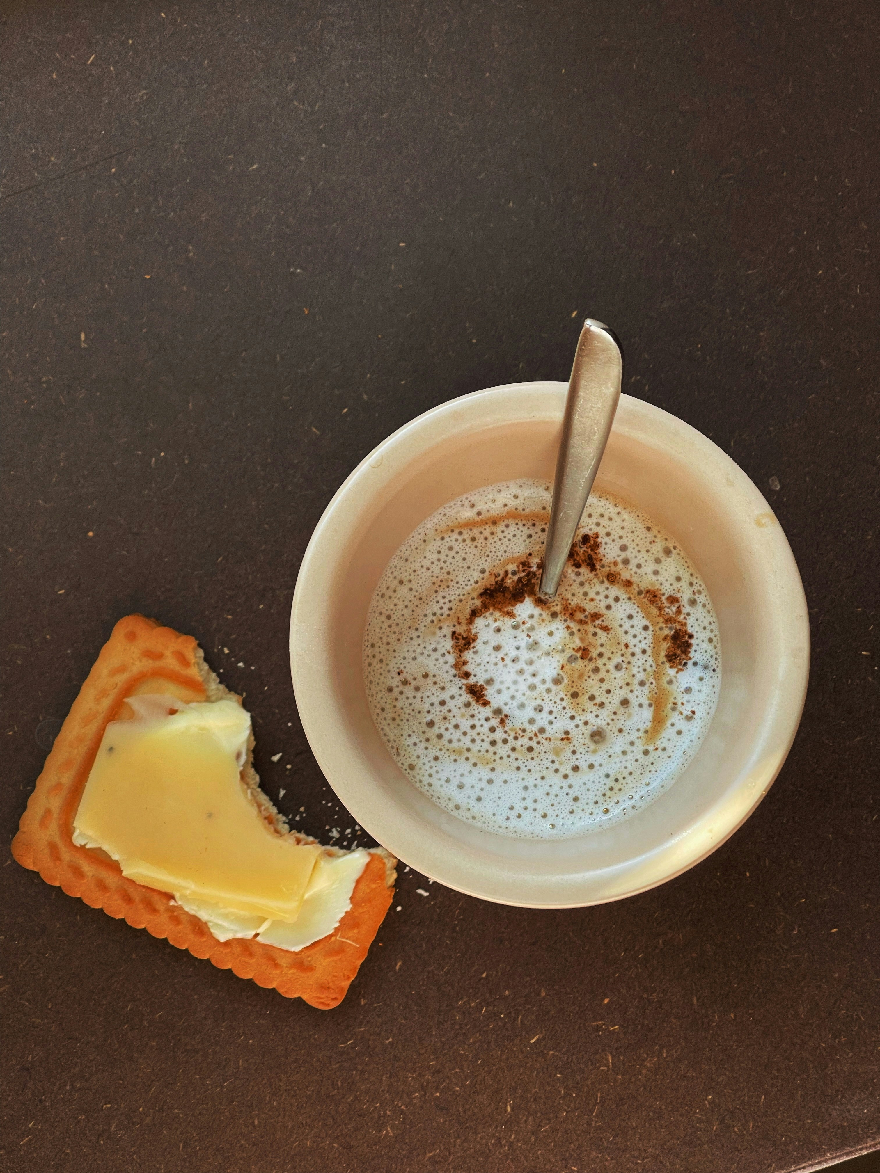 Cream and Cocoa: A Cozy Cup with a Square Biscuit