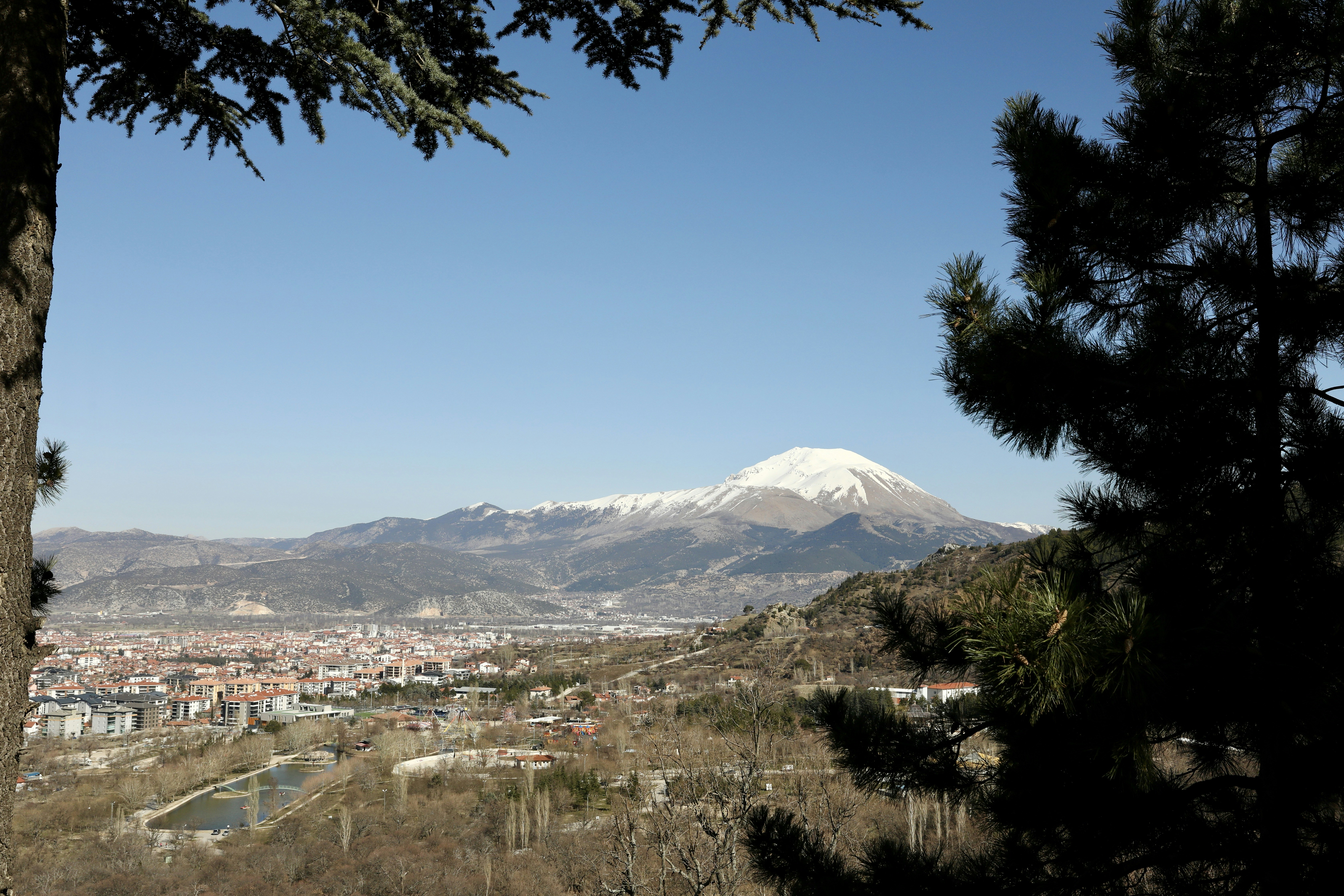 Snow-Capped Summit Over a Terraced Vallejo Town