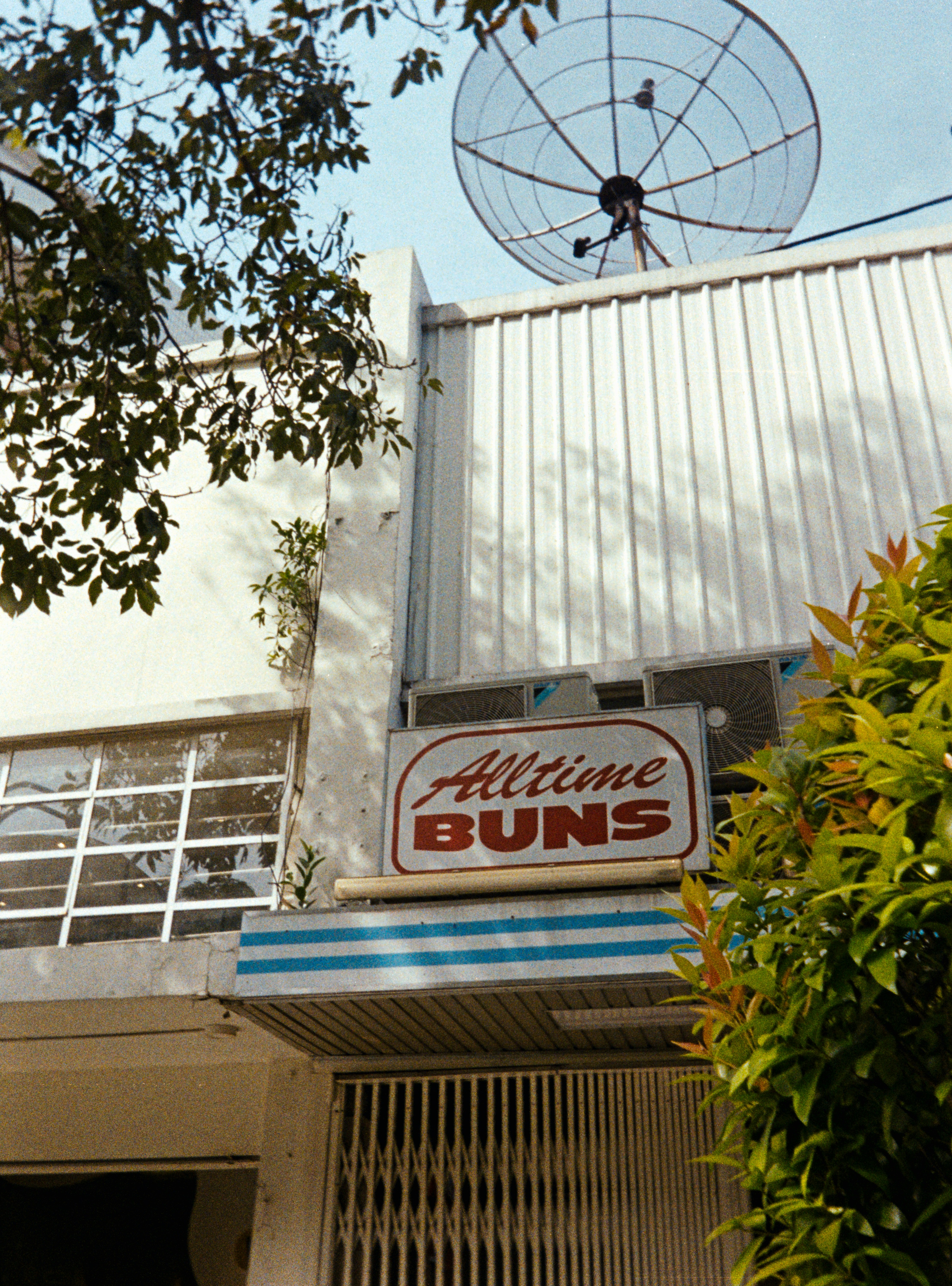 Diner Sign Beneath a Satellite Dish