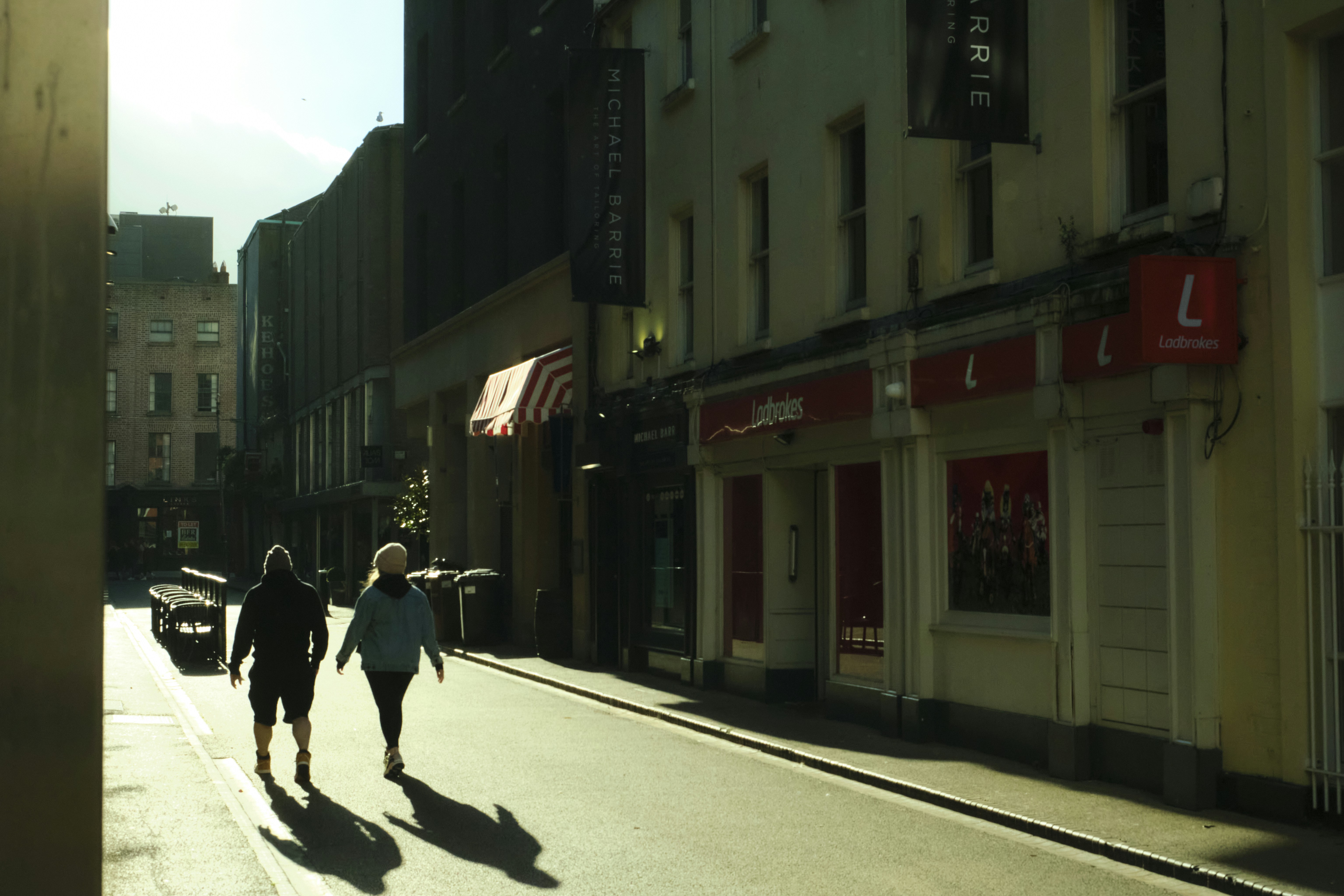 Golden Hour Stroll: Street Shadows and Quiet Commerce