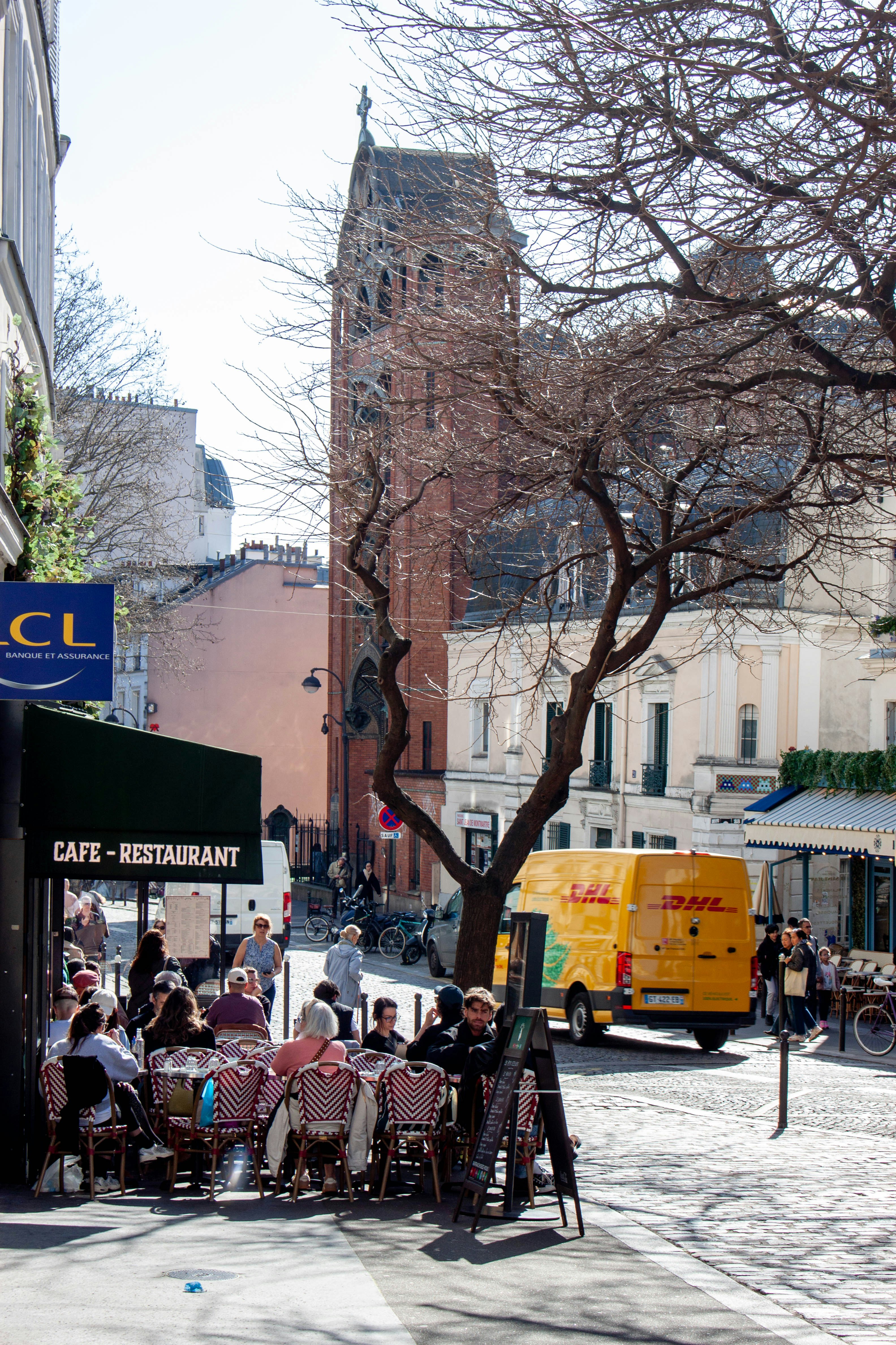 Café Street Portrait under a Leafless Tree