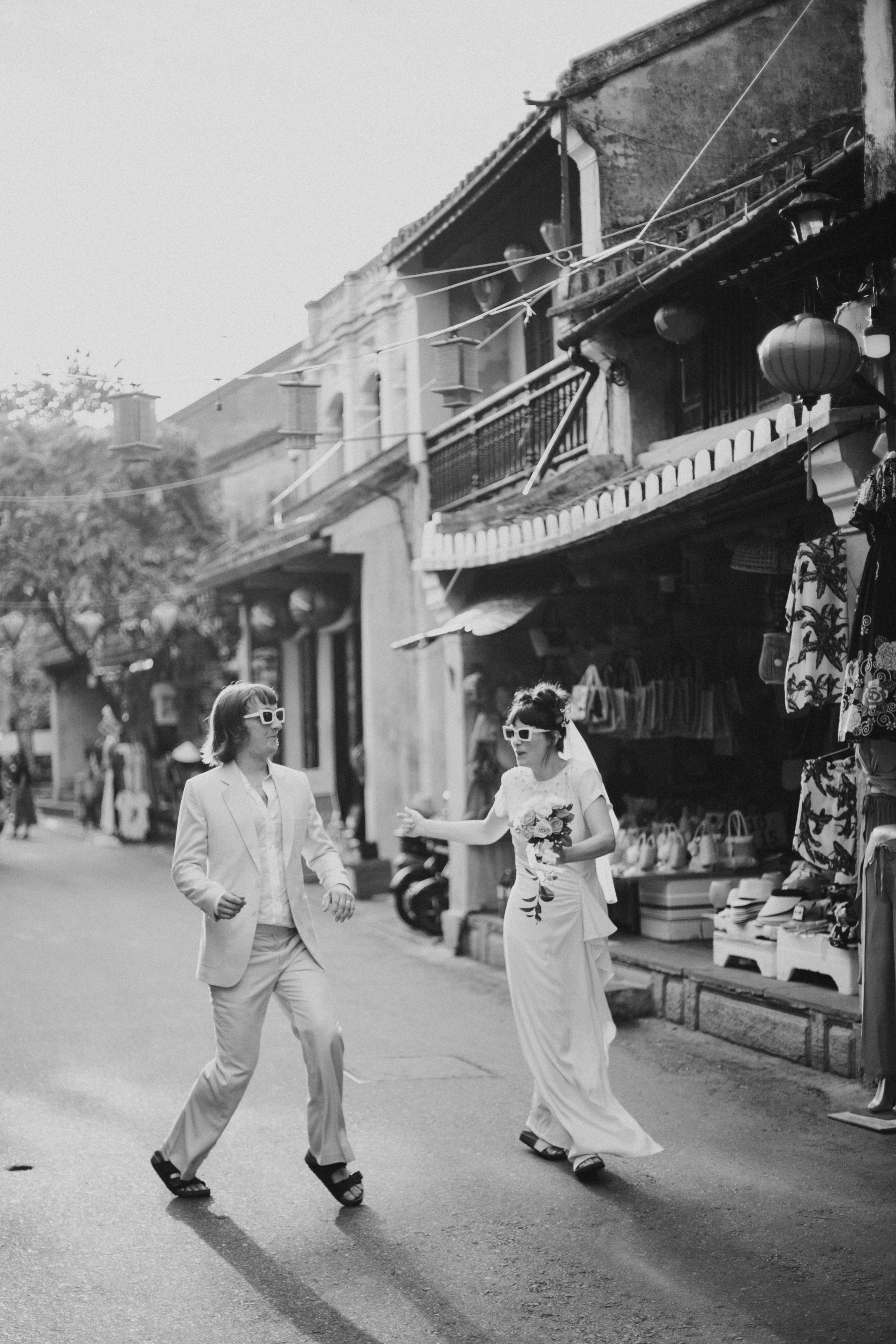 Bride and Groom in a Quiet Street: A Timeless Moment in Monochrome