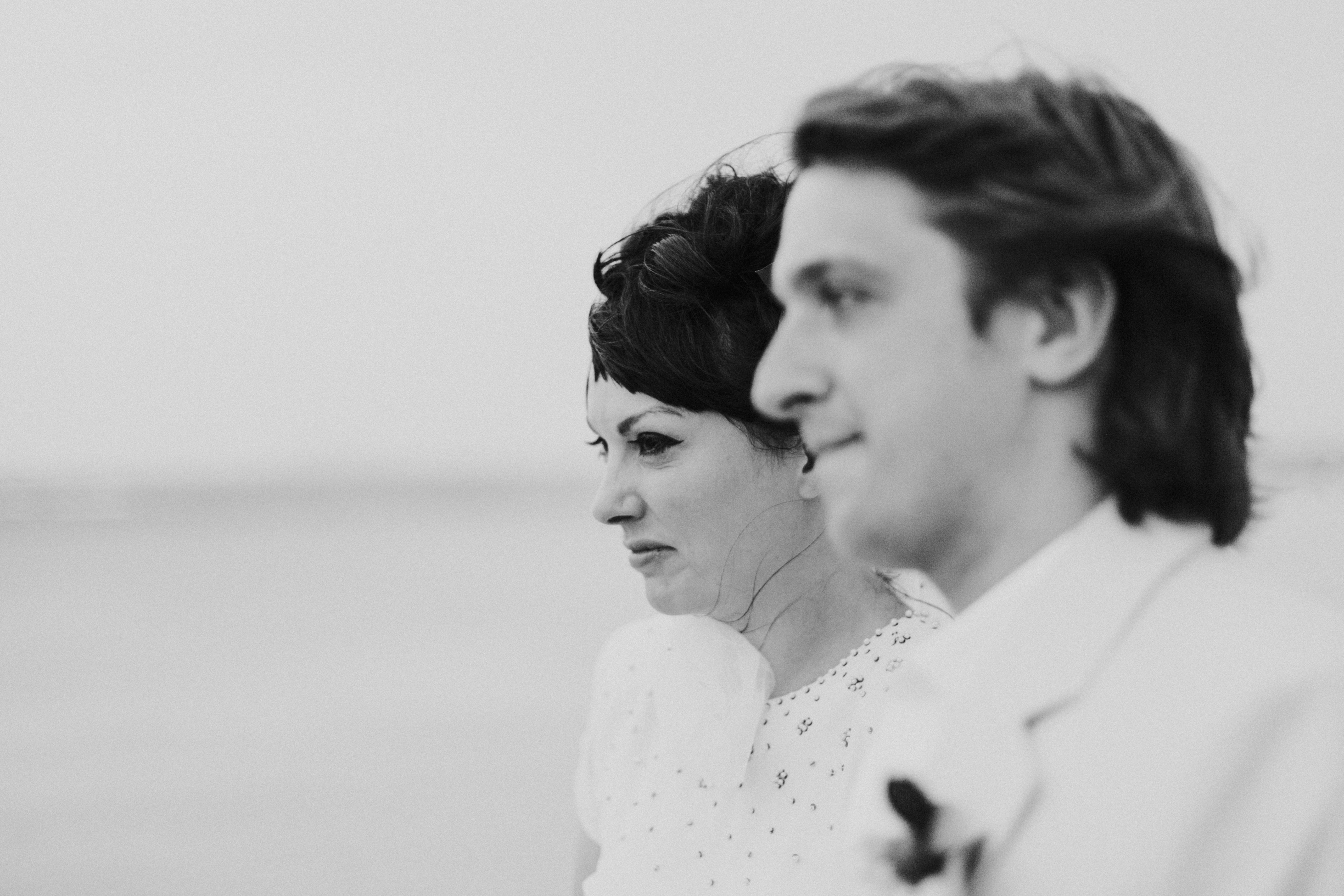 Two Silent Faces at the Edge of the Sea