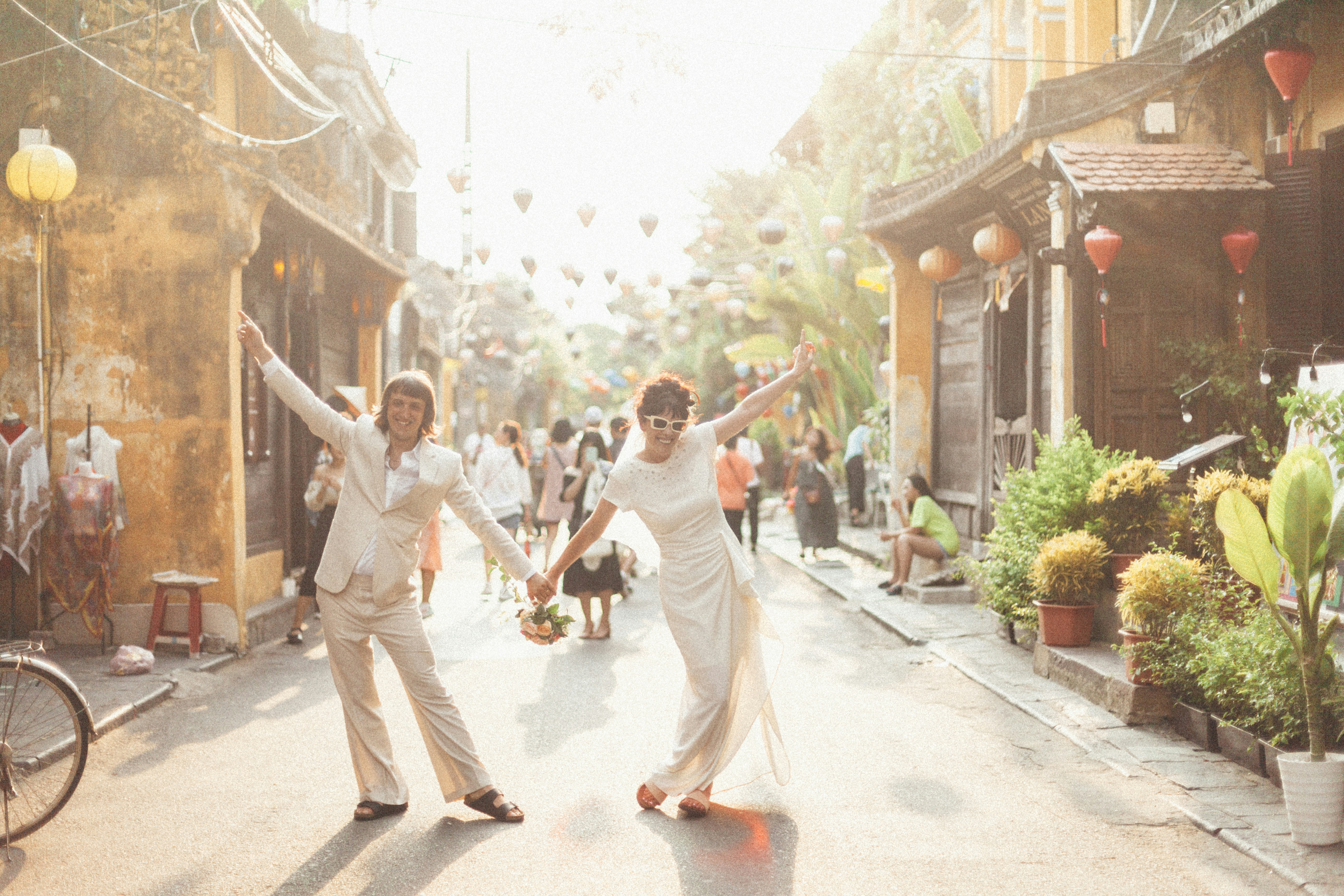 Joyful wedding in a sunlit street