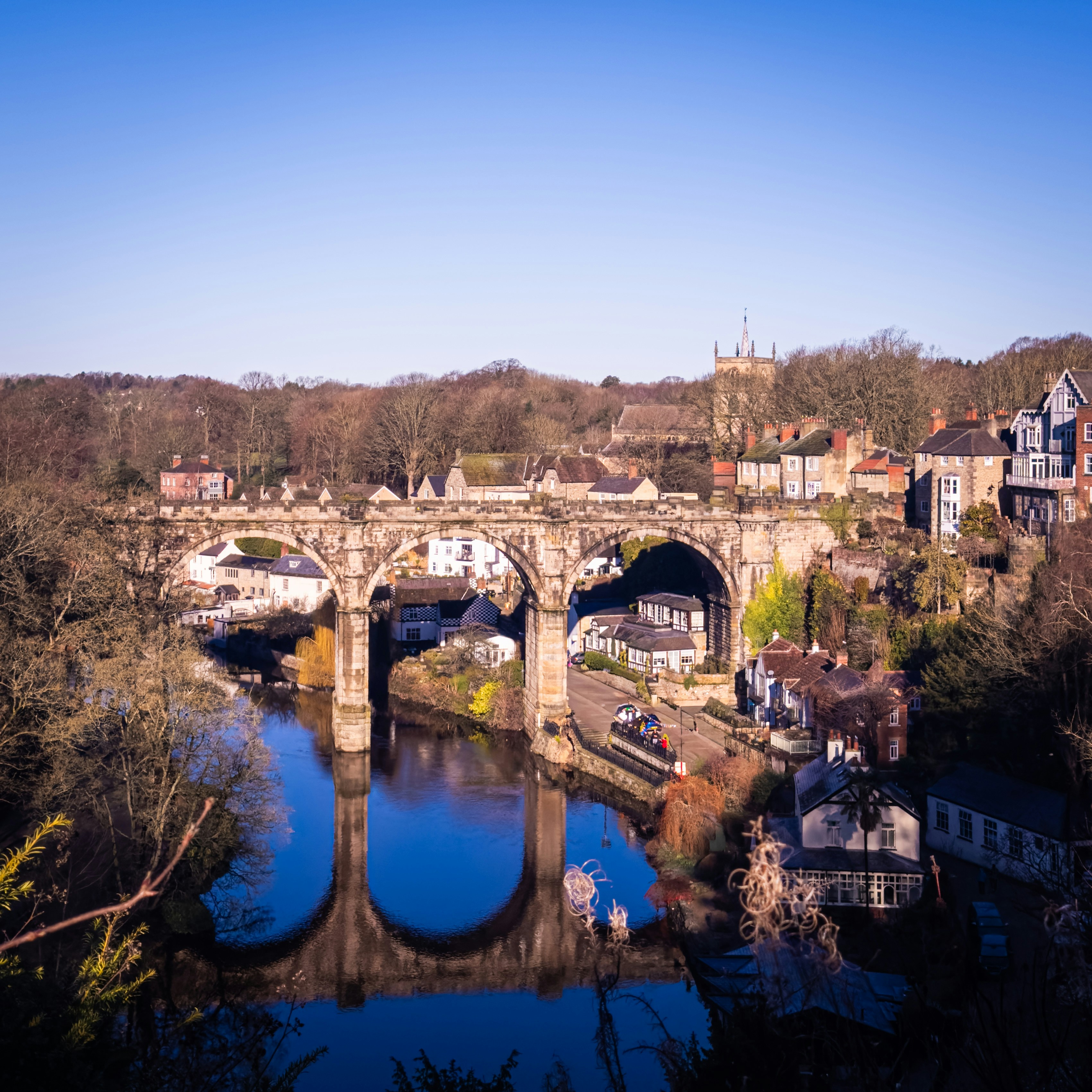 Stone Archways Over the River: A Quiet Town Snapshot