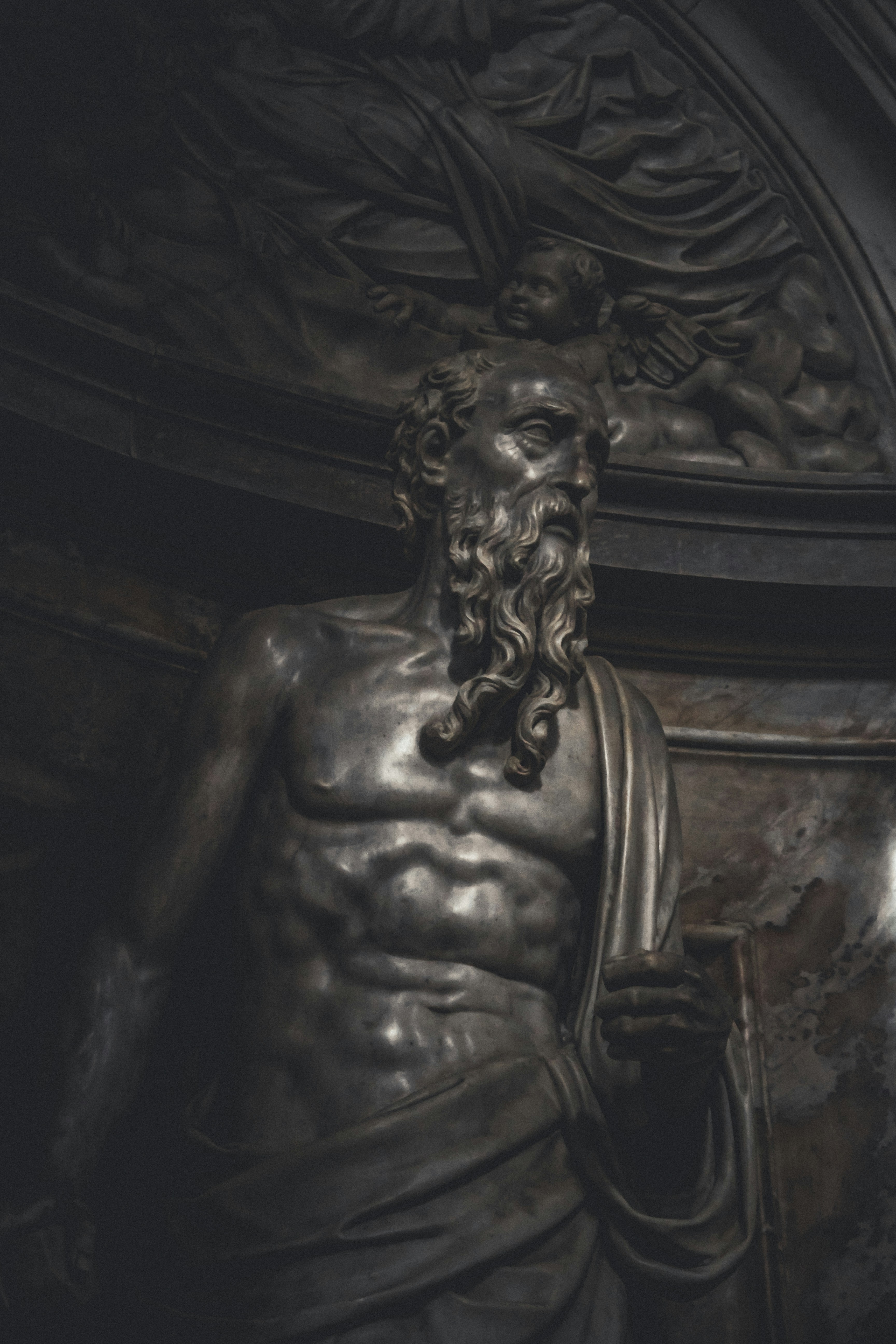 The Eternal Veil: A Bearded Gorgon in Dim Light