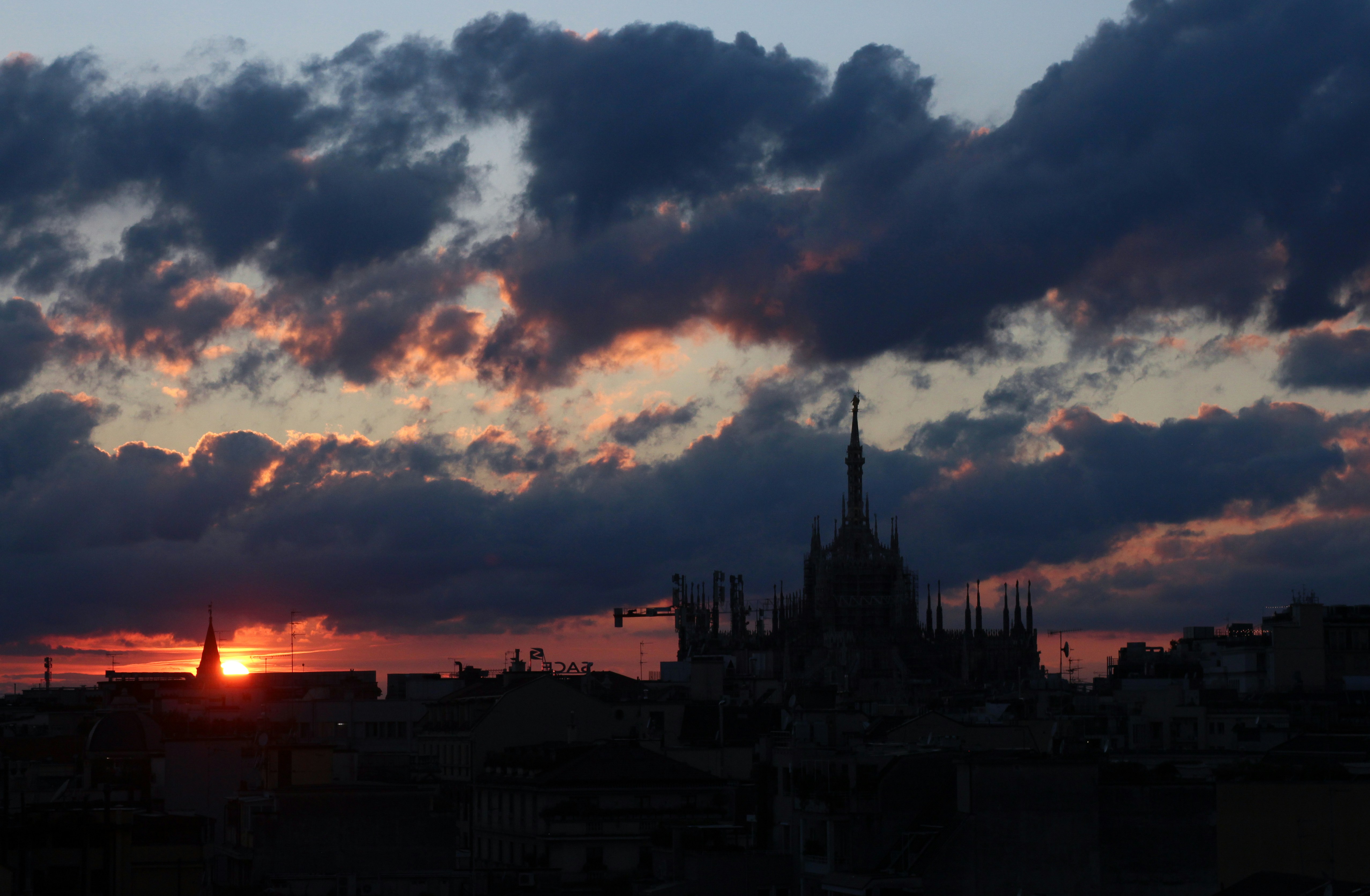 Sunset Silhouette over a Gothic Skyline
