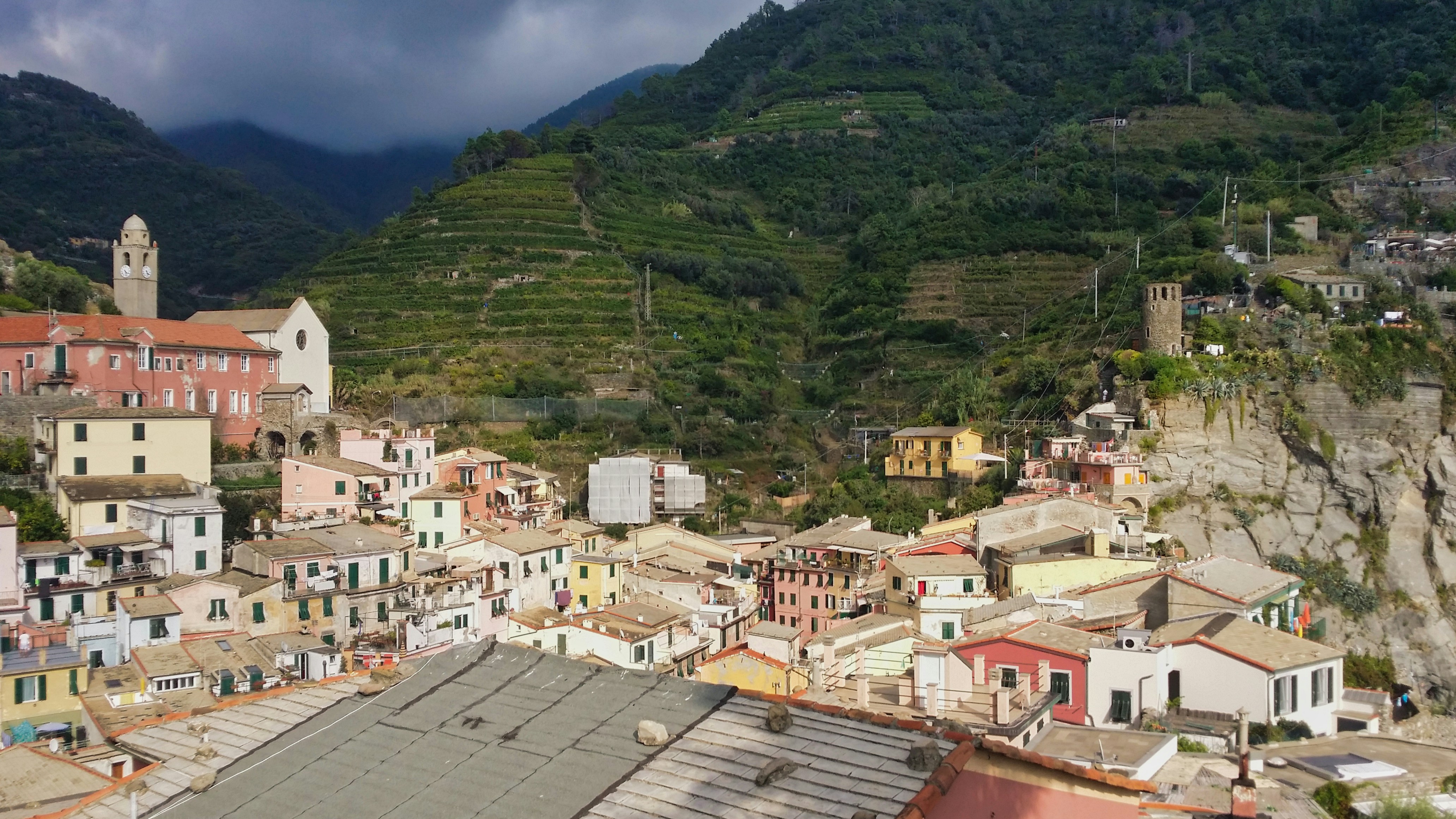 Colorful buildings on a cliffside overlooking the sea