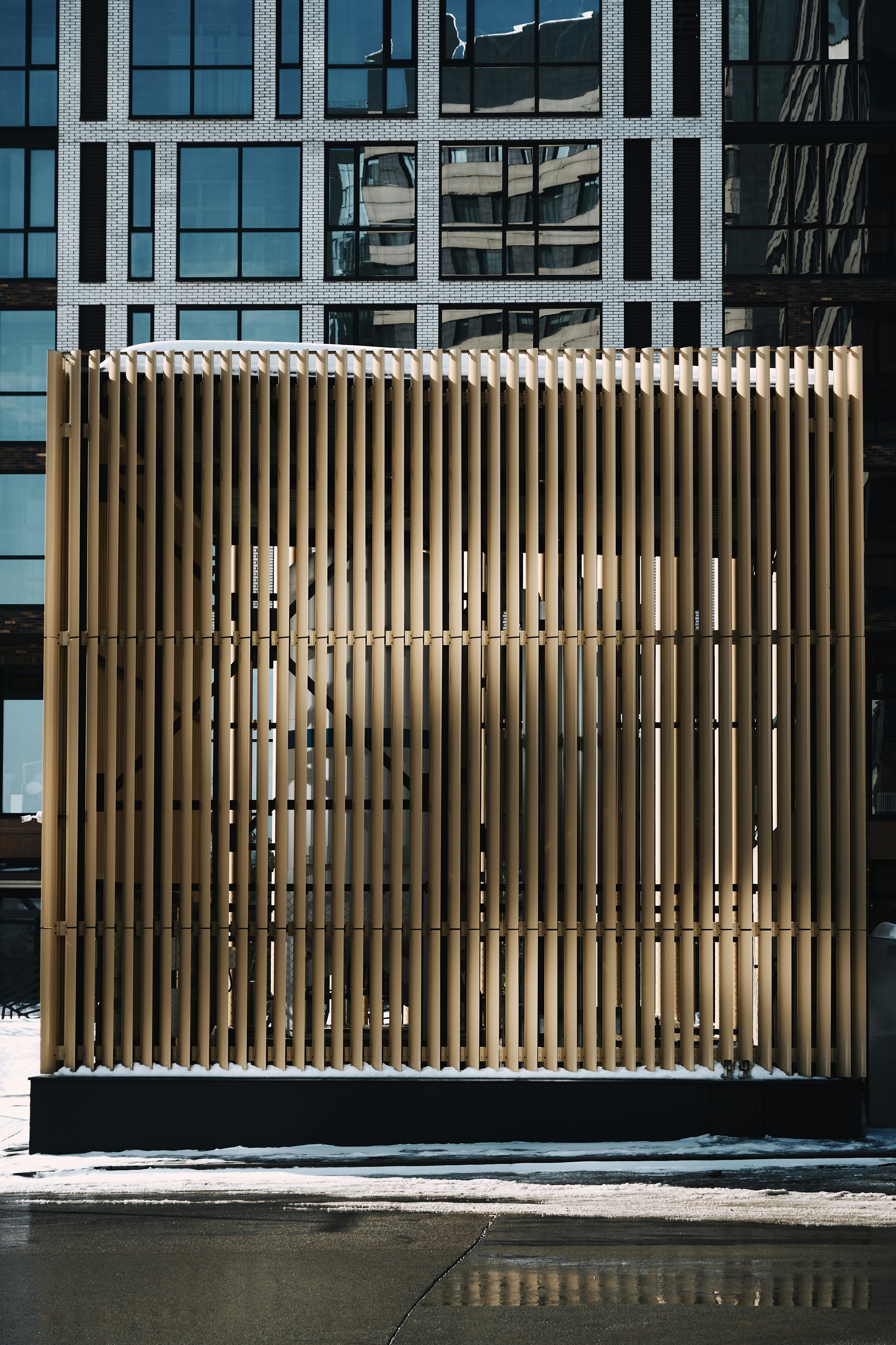 Vertical Slats, Horizontal Silence: A Sculpted Facade in Cold Light
