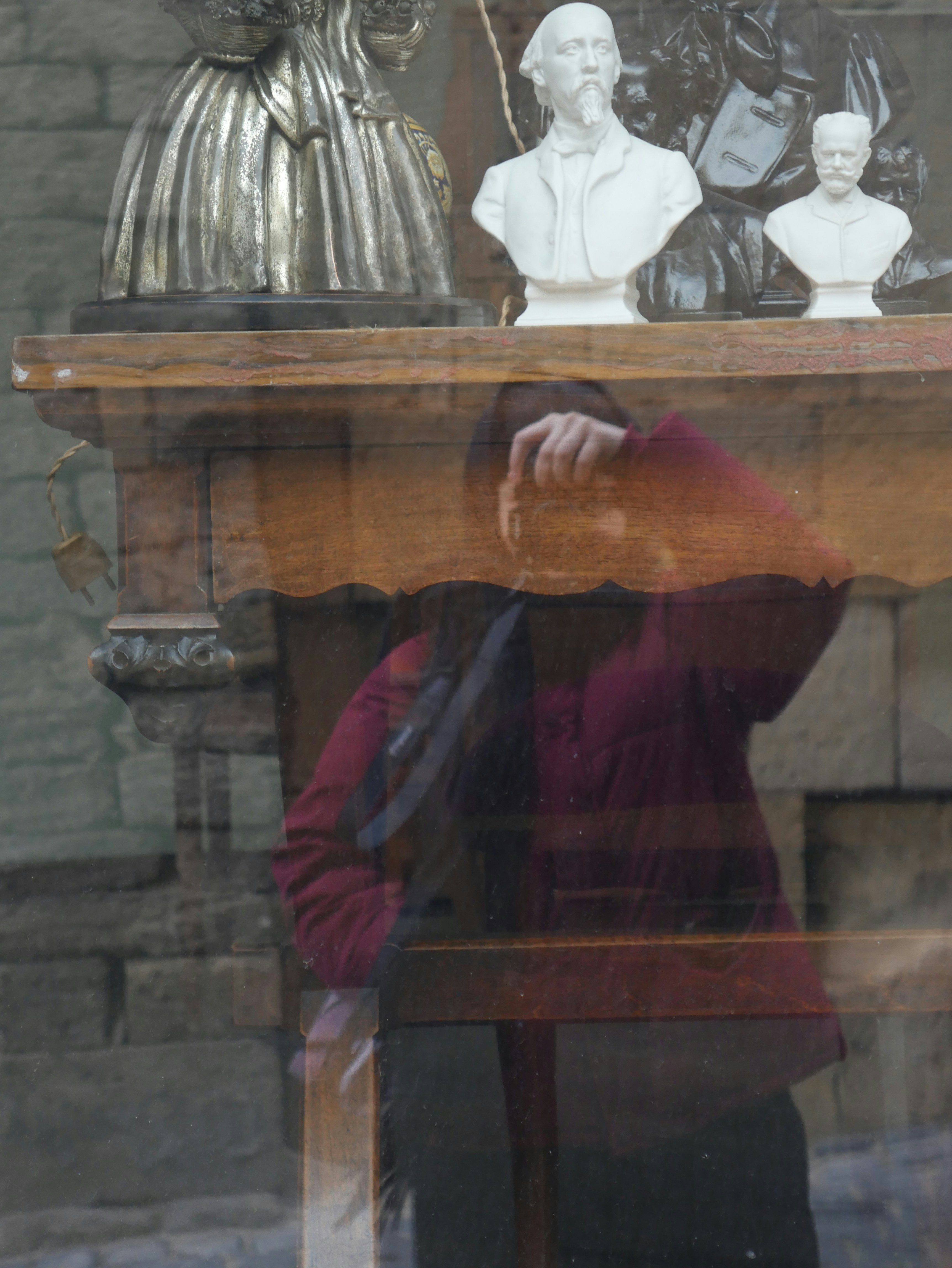 Reflected Echoes: A Portrait Behind Glass and Wood