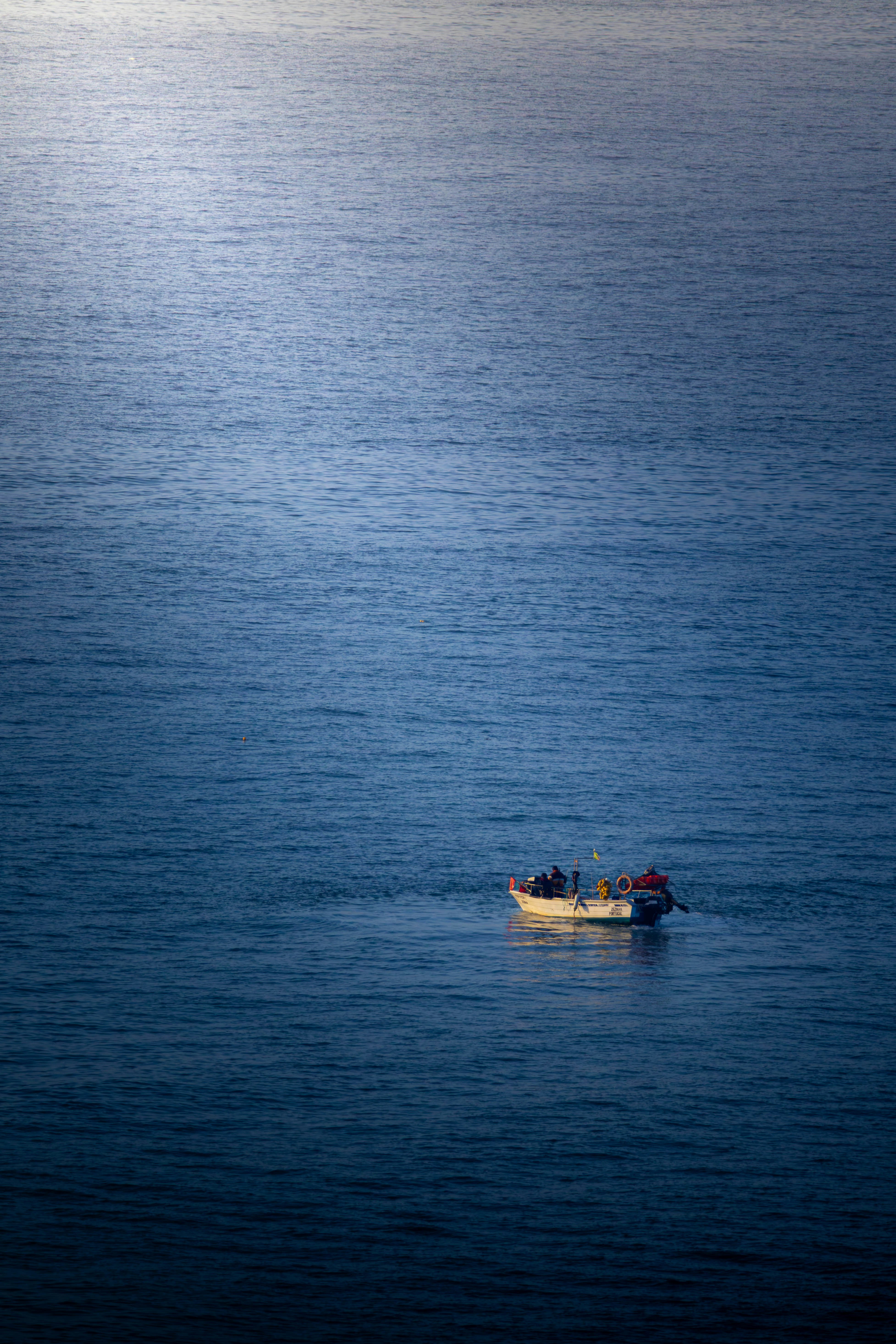 Tiny Boat, Vast Sea: A Quiet Lifeline on Deep Blue