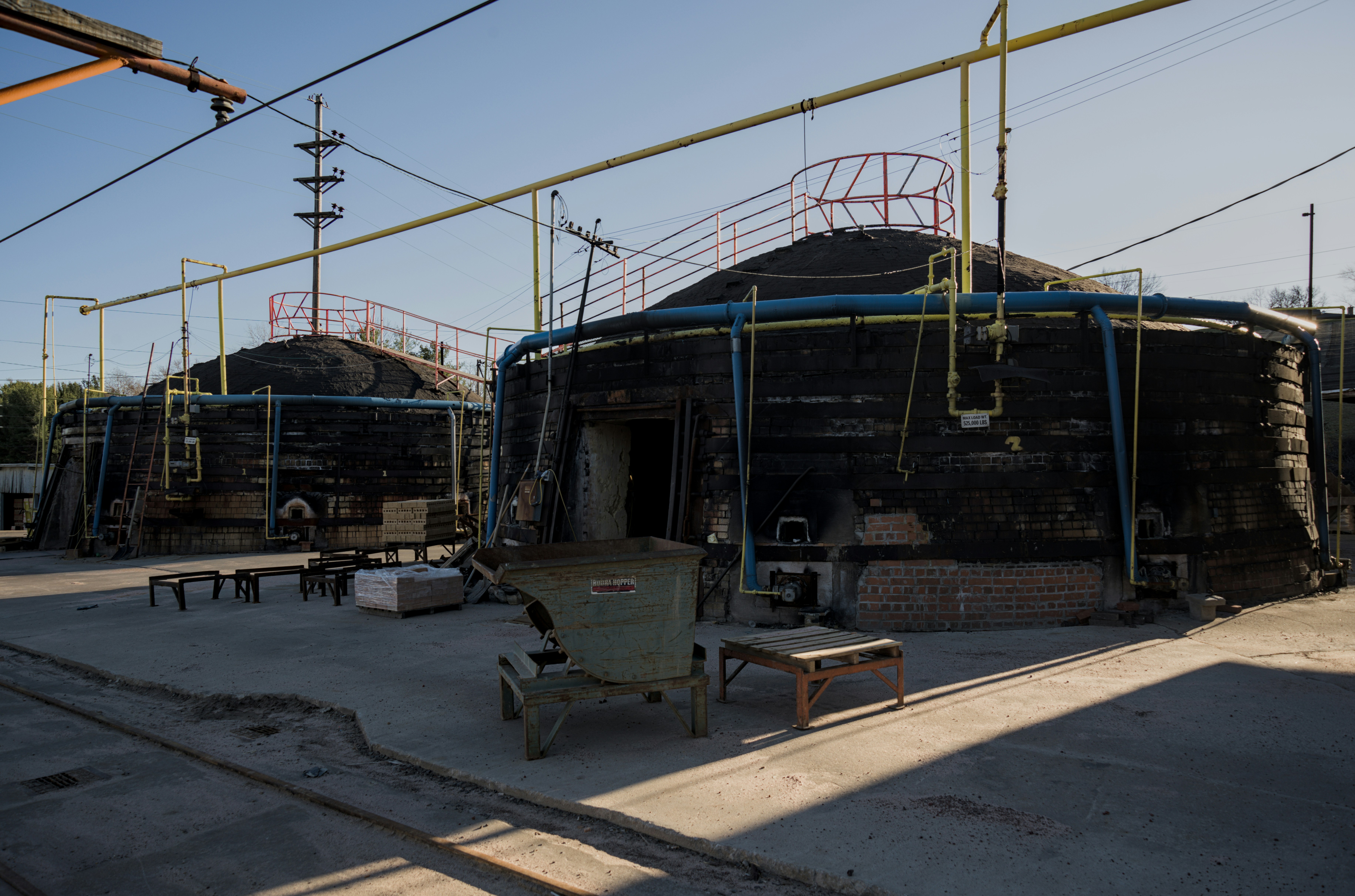 Industrial Circles: Weathered Kilns under a Network of Pipes