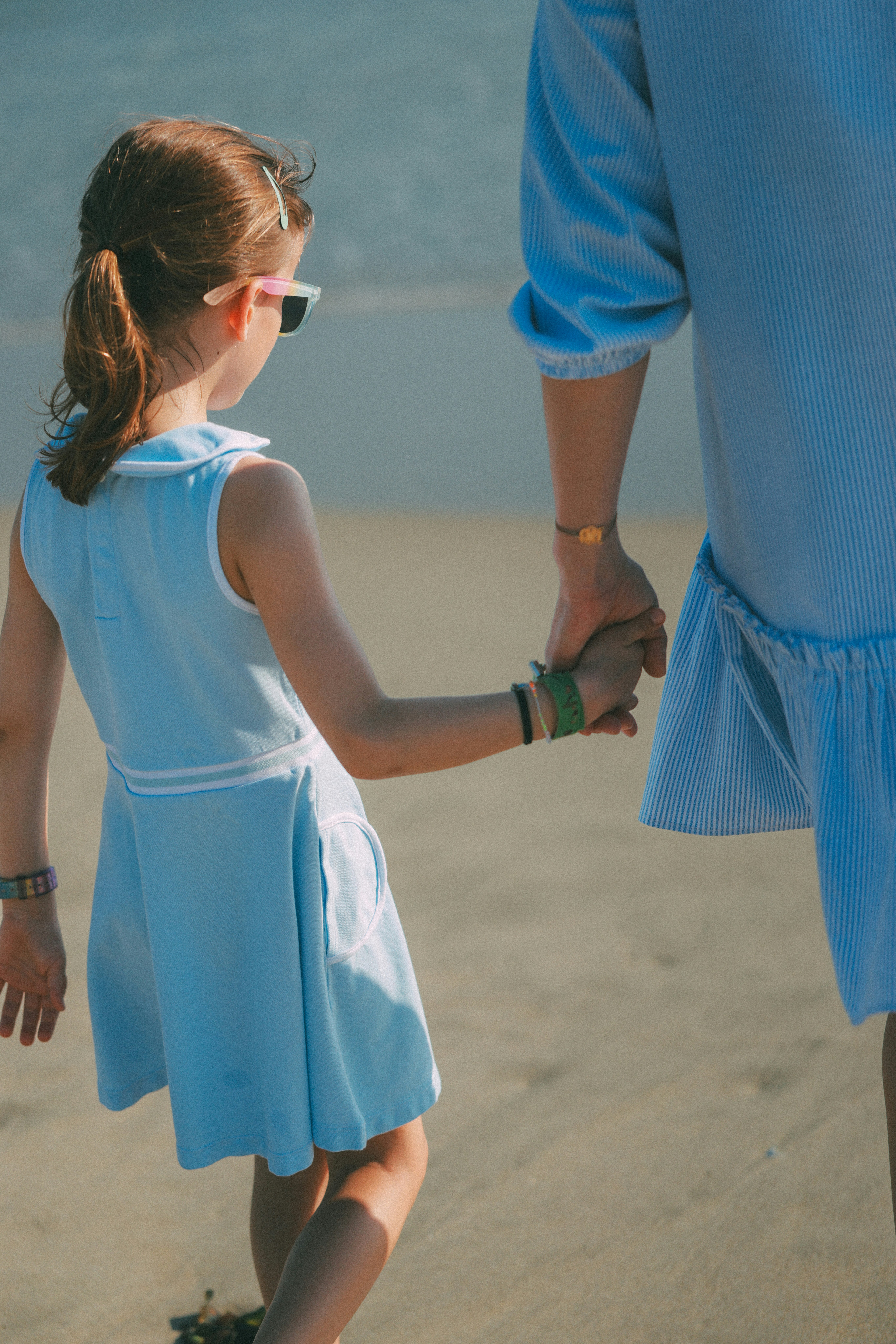 Holding Hands on the Shore: A Quiet Bond at the Beach