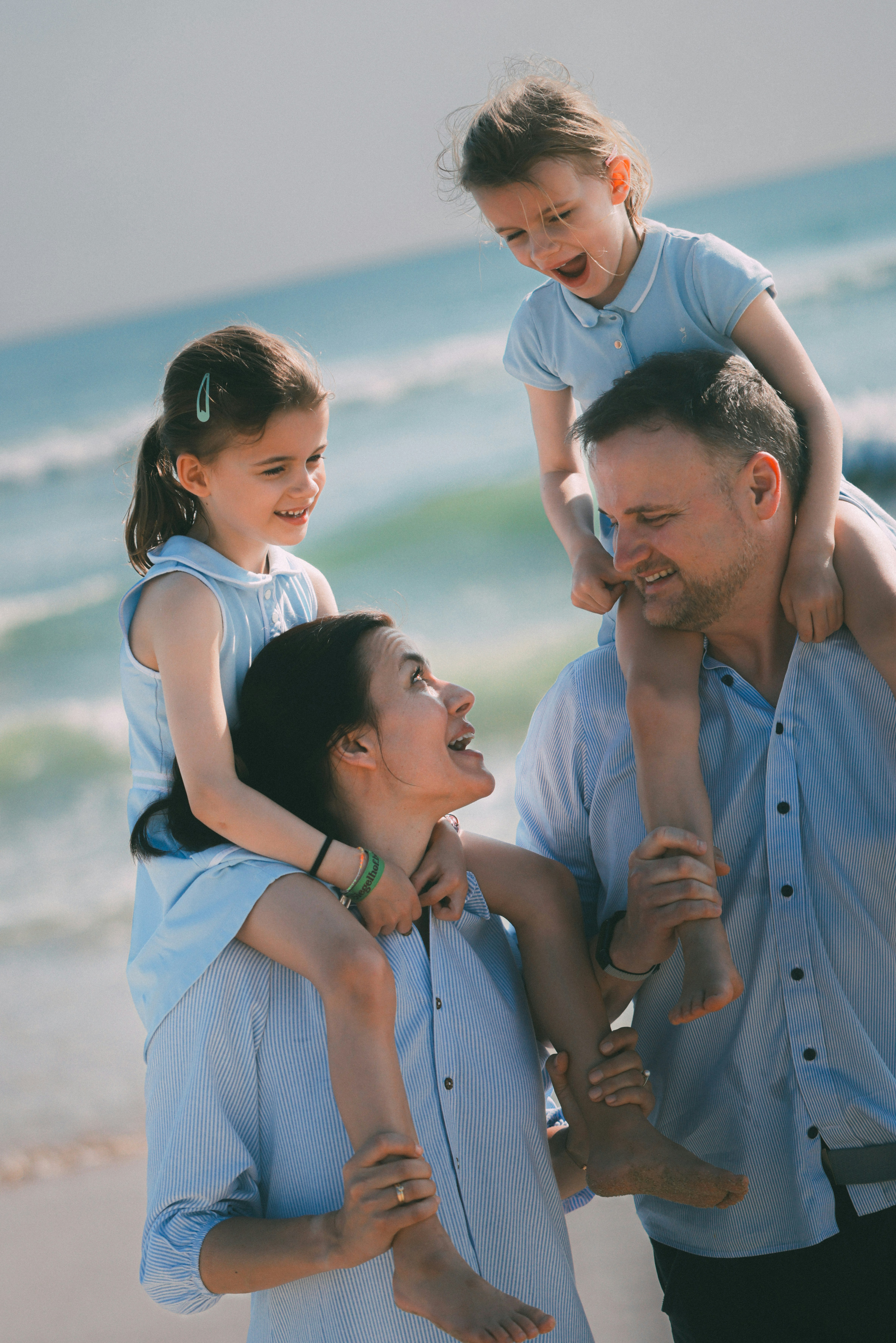 Joyful Beach Portrait: Hands On A Happy Family