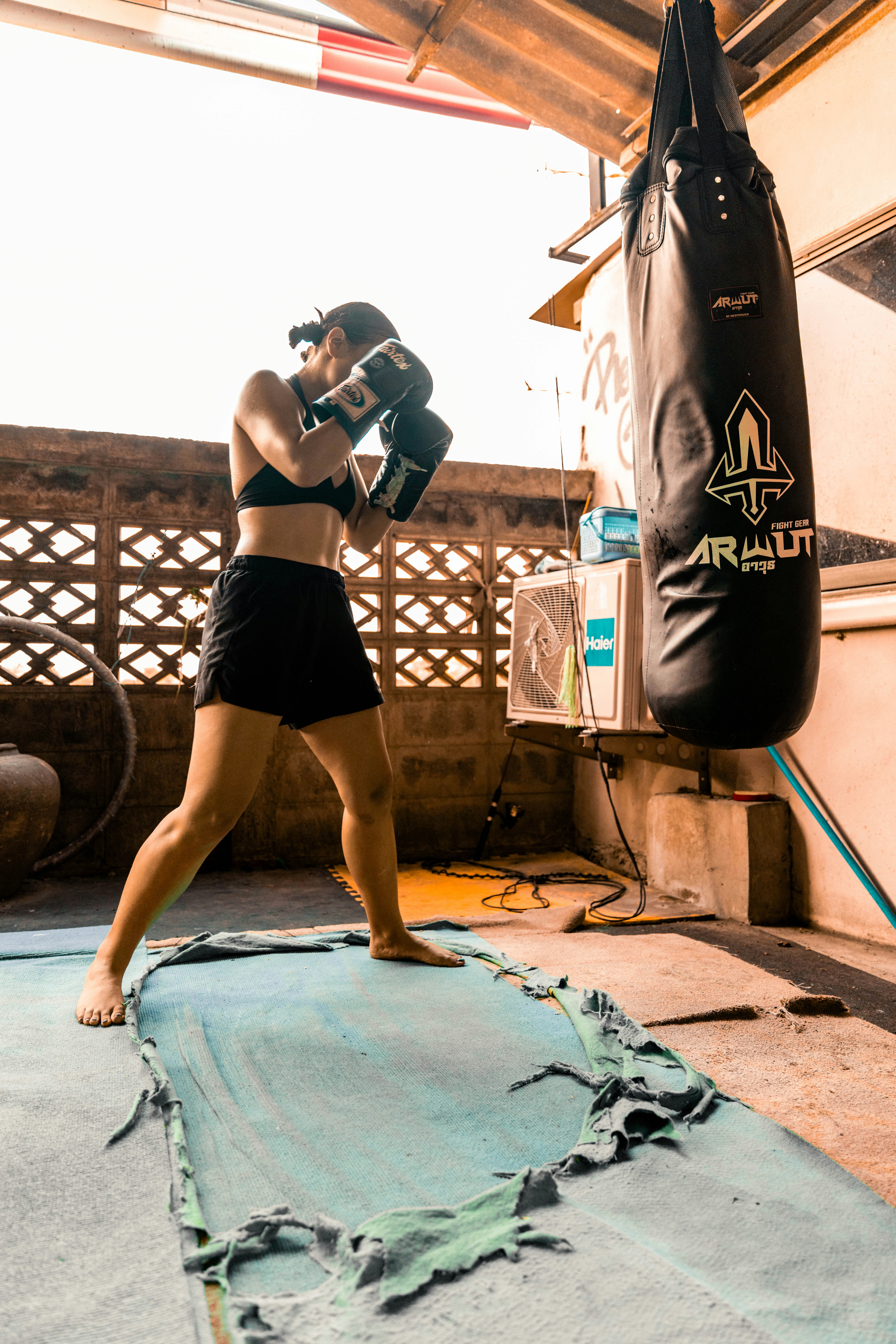 Boxing in the Quiet Alley: A Muay Thai Shadow in the Gym Light