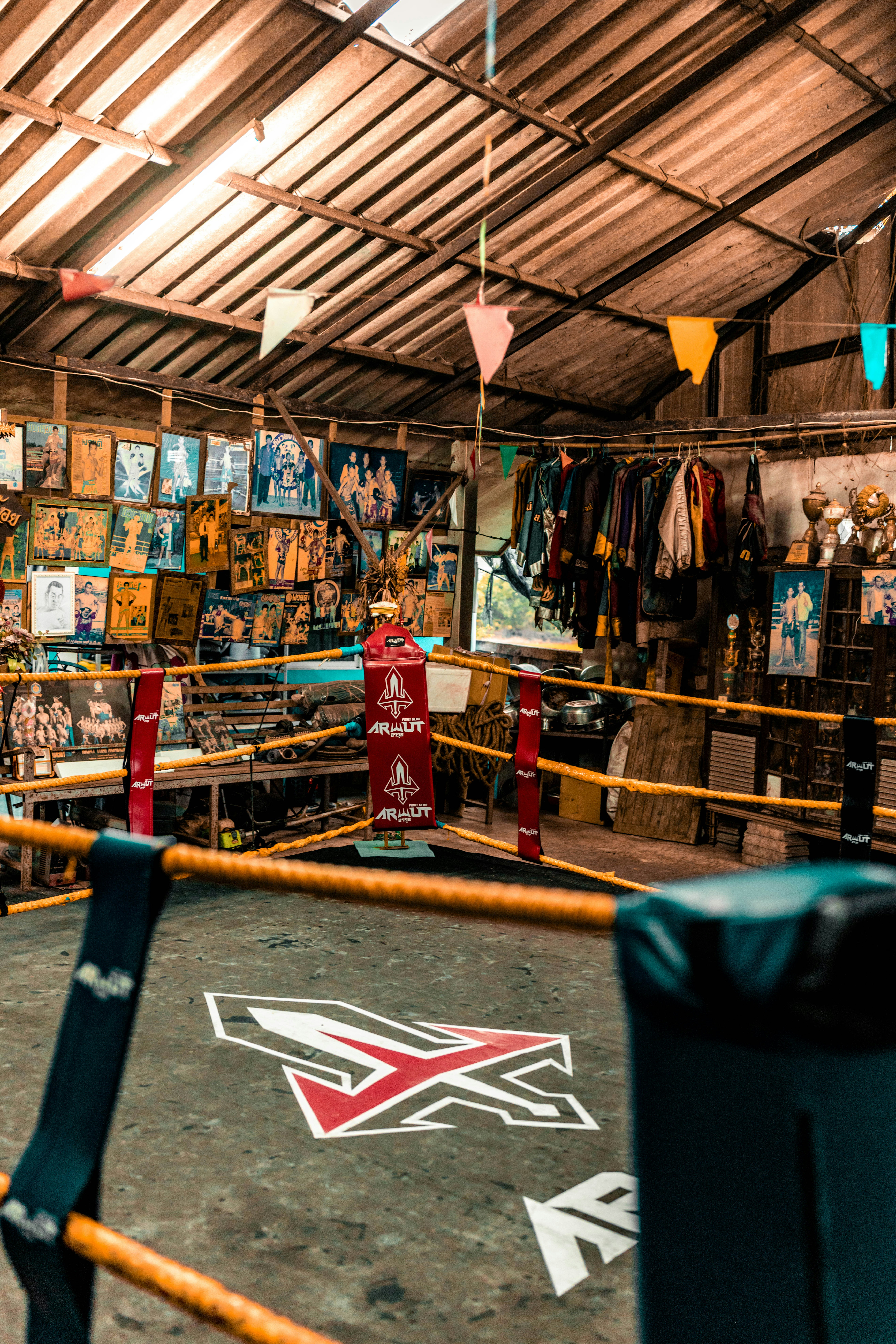 Urban Gymnasium: A Boxing Ring Amid Posters and Banners