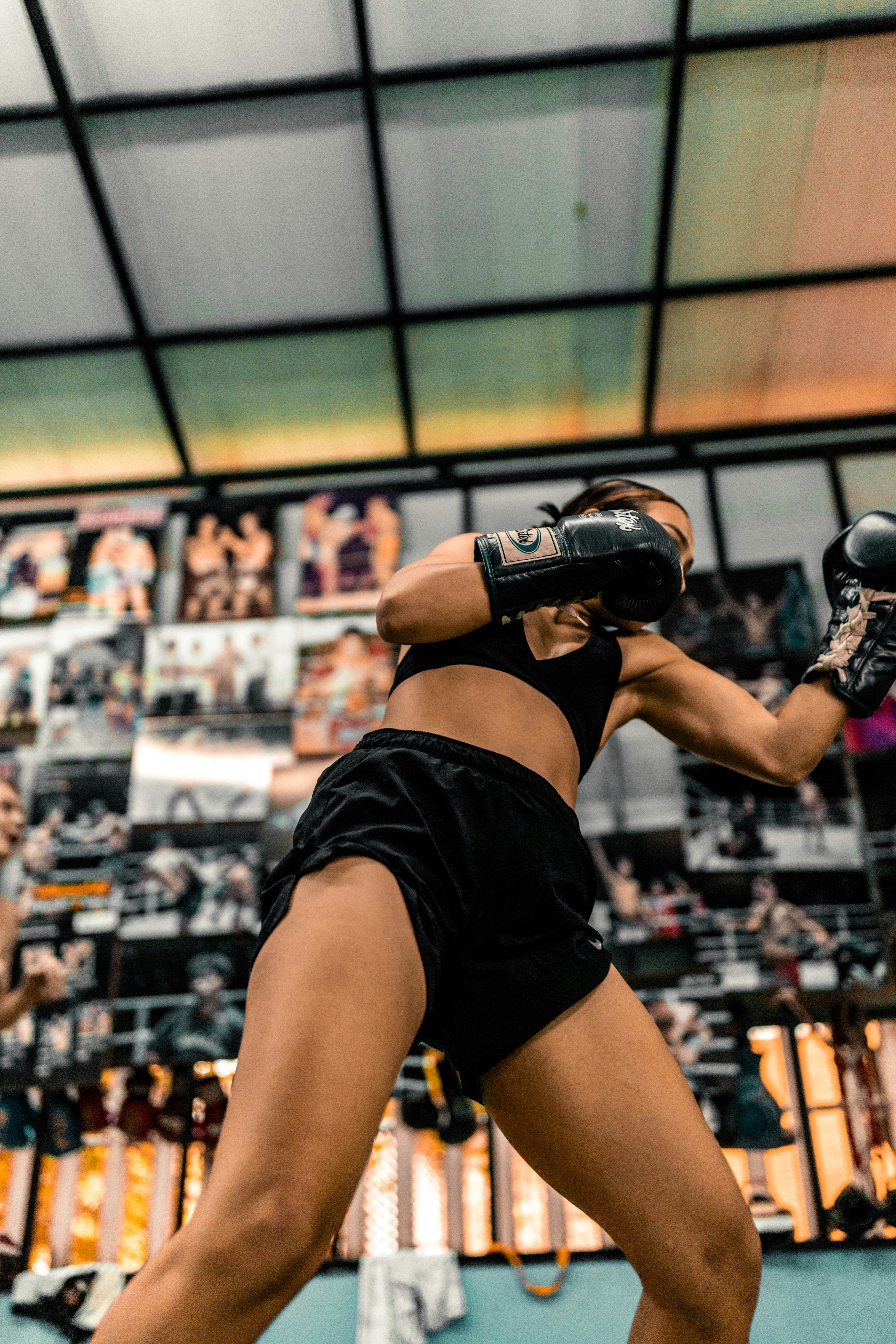 Punching Through the Ring Lights: A Dynamic Boxing Moment in a Studio Gym