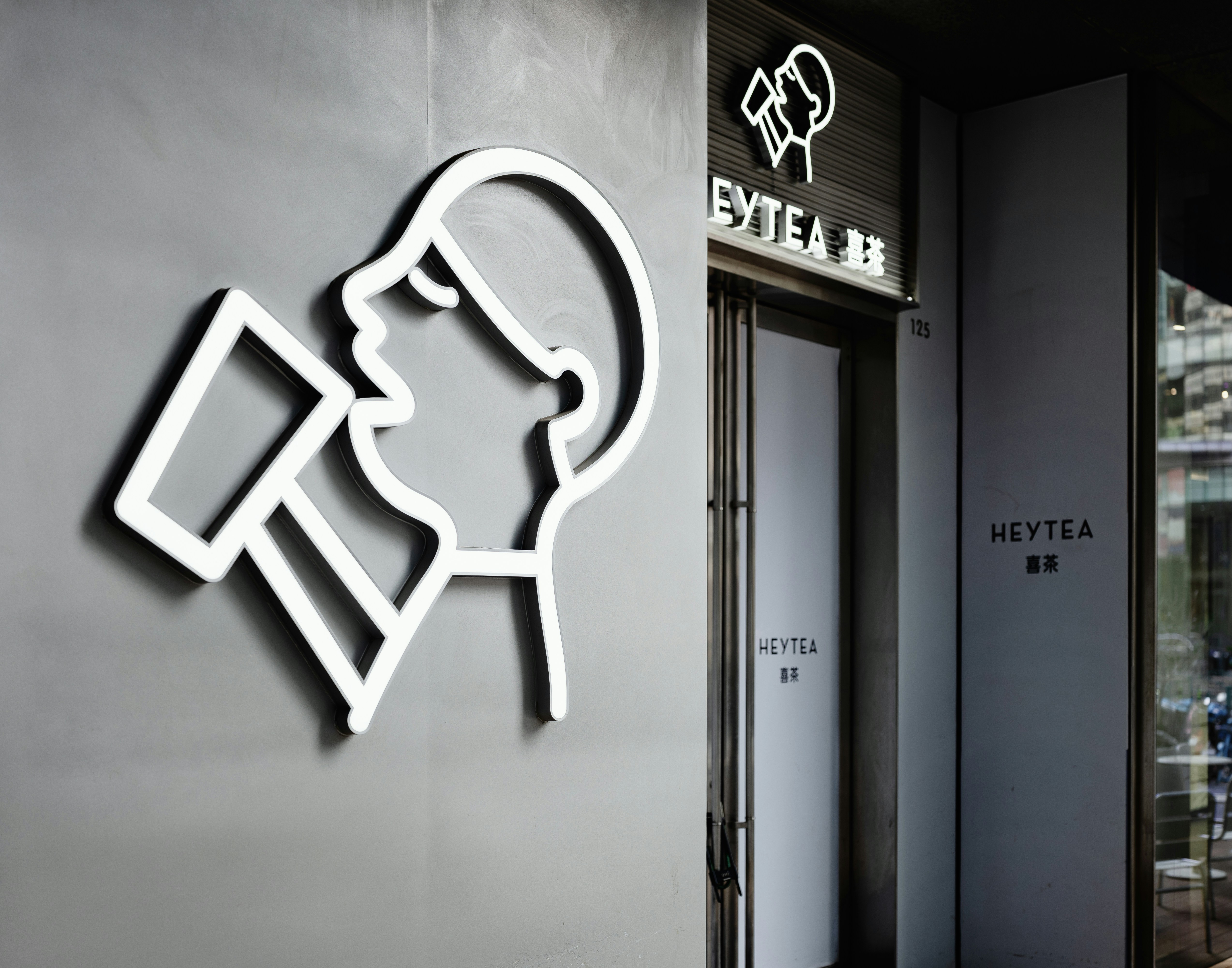 Neon Lip Service: A Quiet Brand Sign by the Storefront