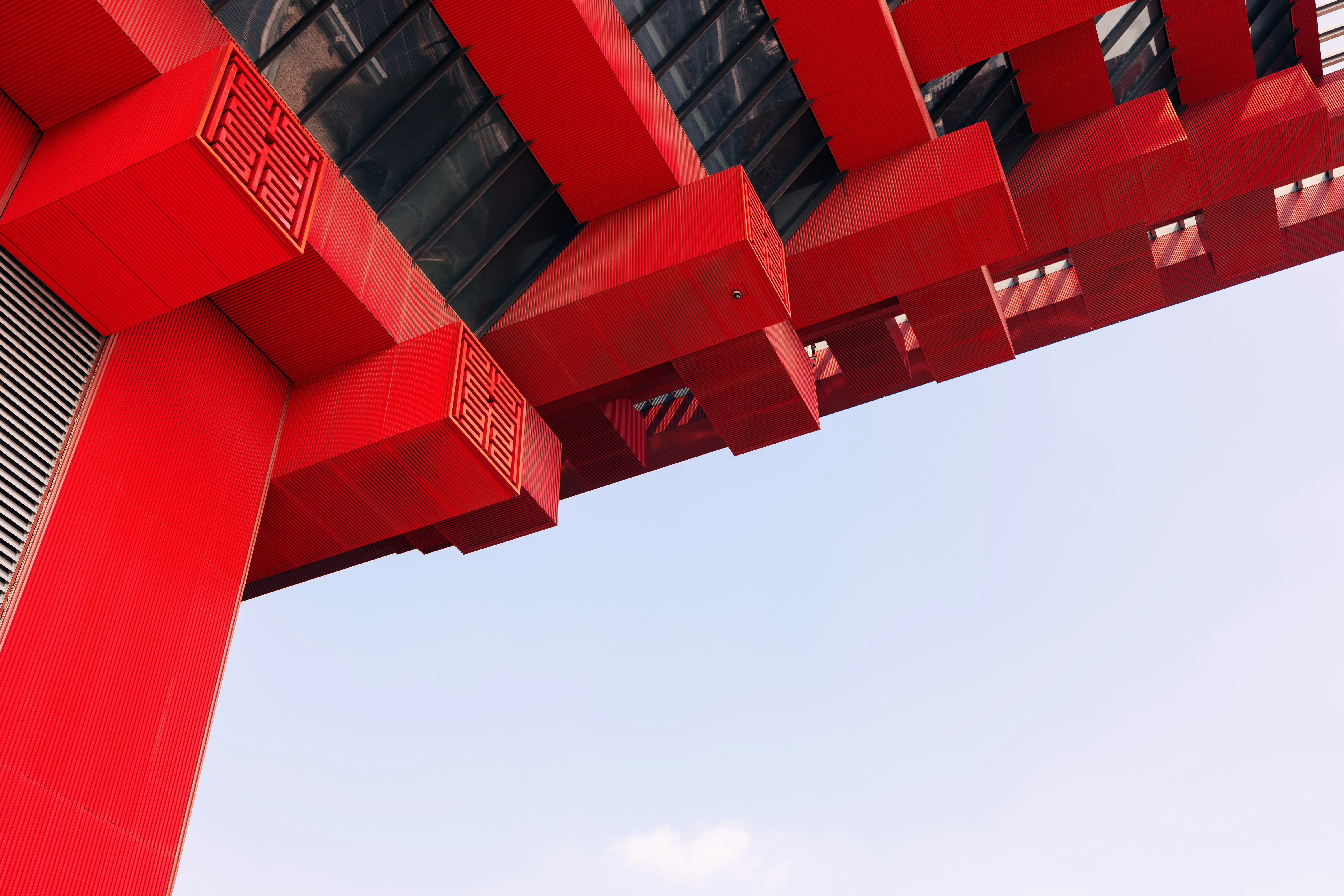Crimson Structural Geometry against a Clear Sky