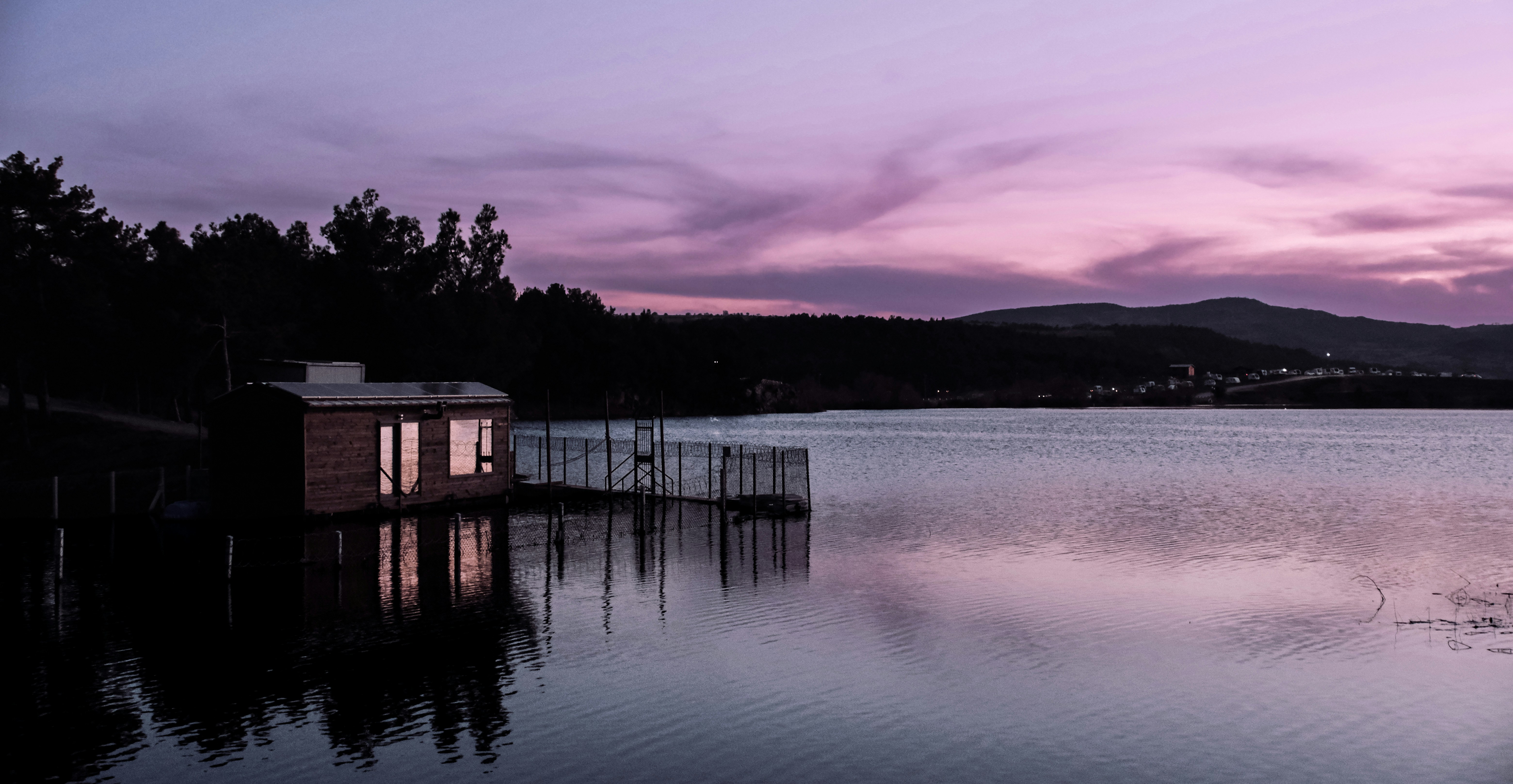 Dusk on the Quiet Lake: A Cabin by the Still Water