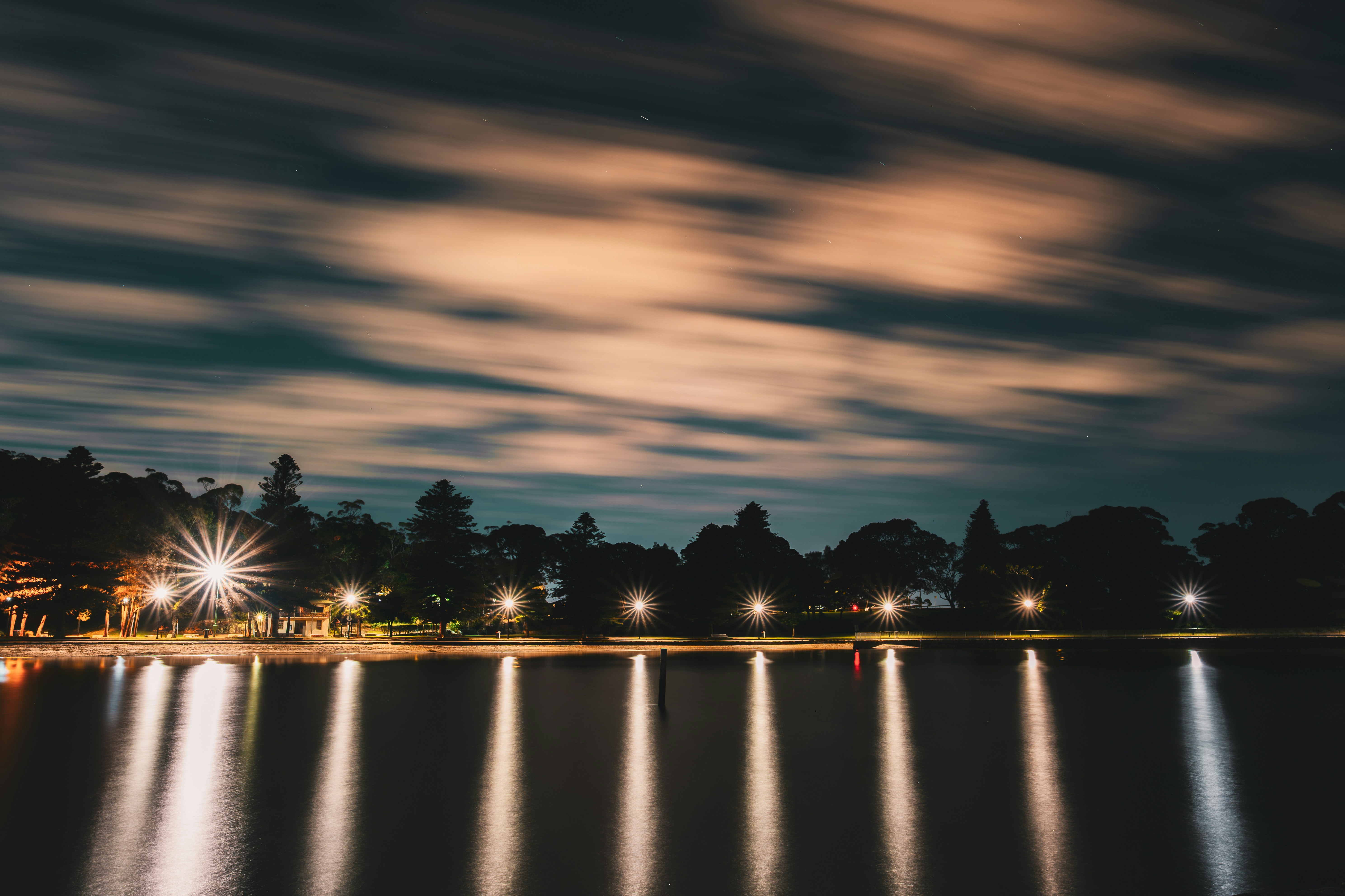Stars Over a Quiet Lake: Night Lights Dancing on Water