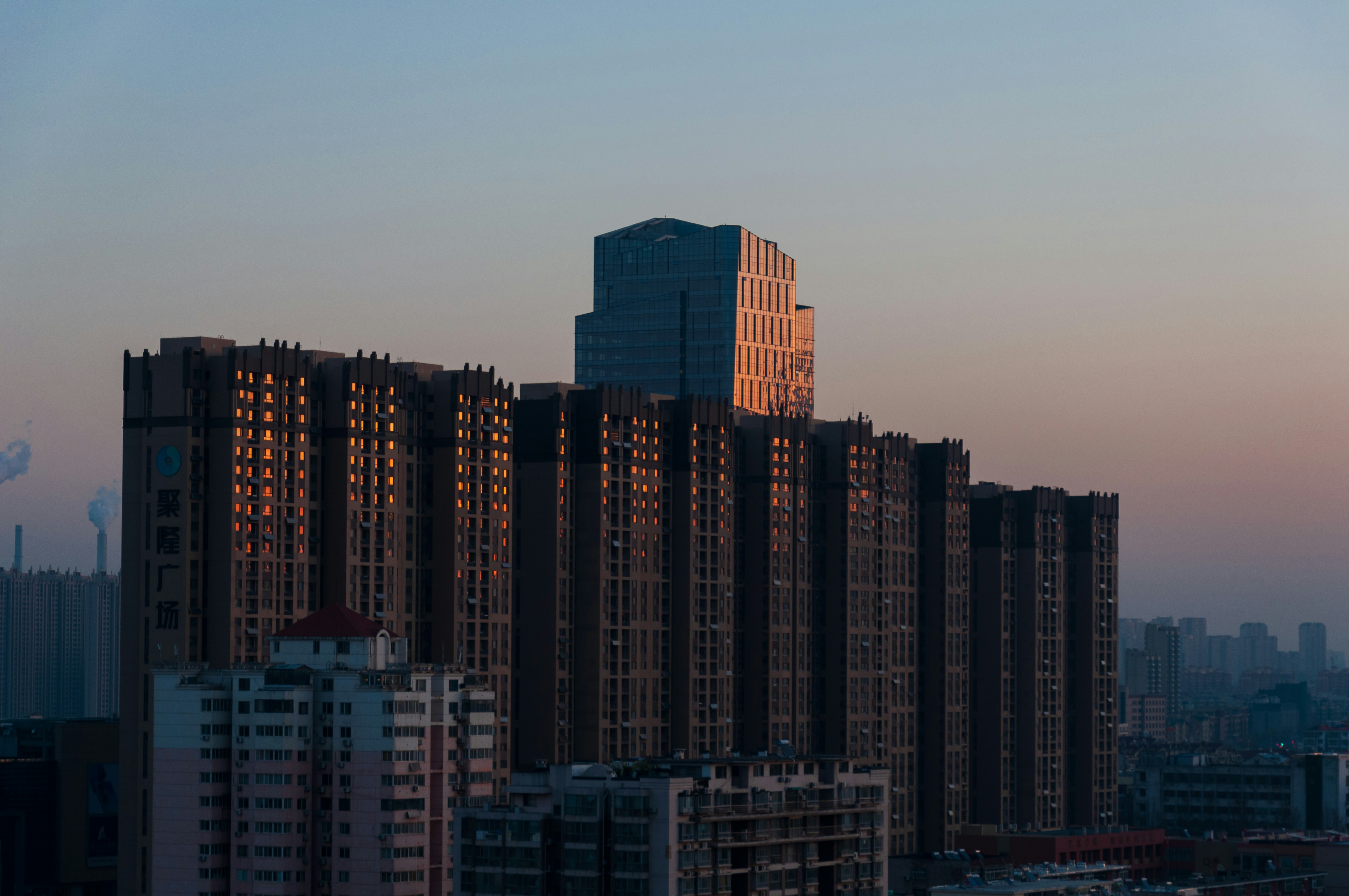 City Skyline at Dusk: A Tower Cresting Above the Mass
