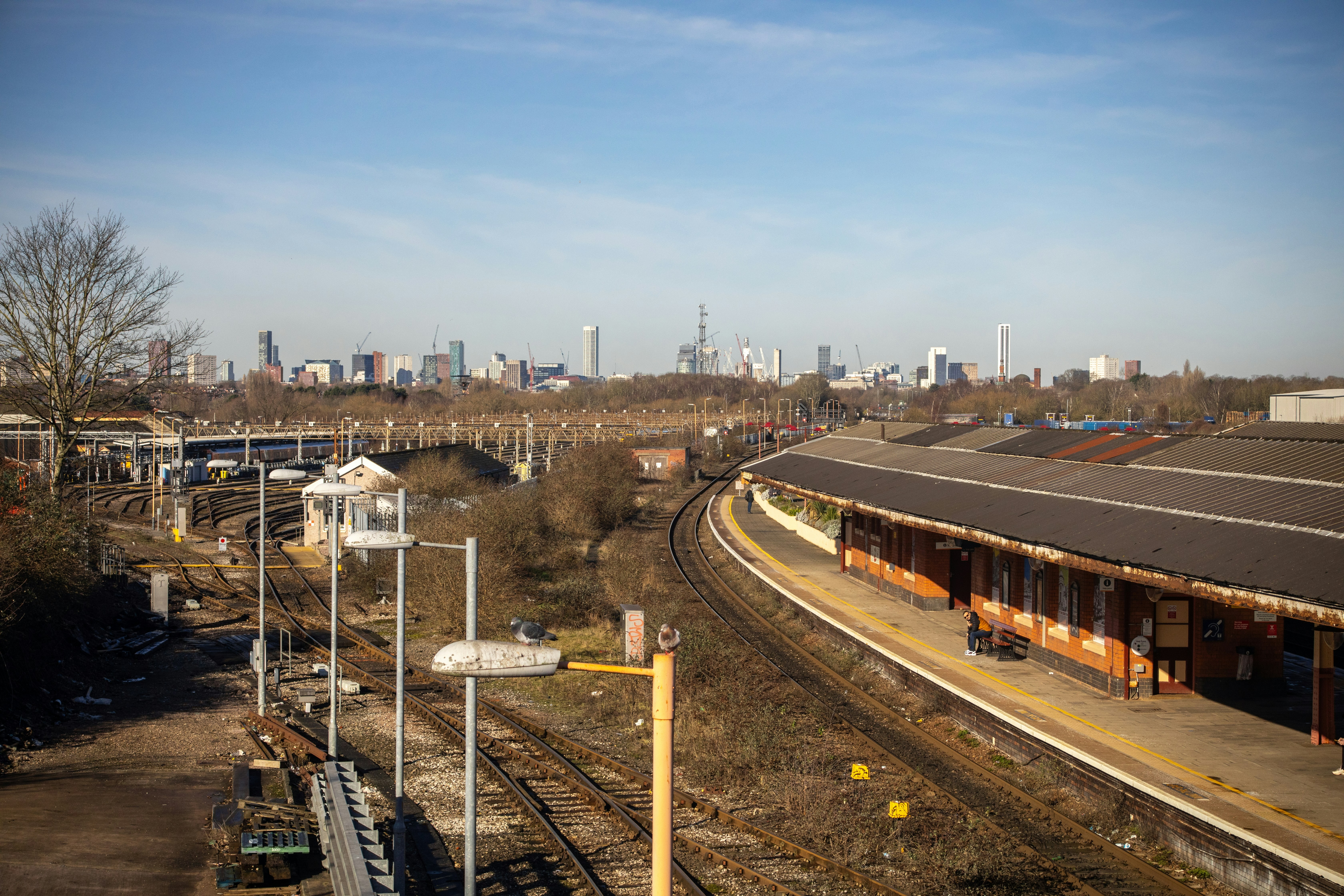 Railway Vista: Tracks Toward a Distant Skyline