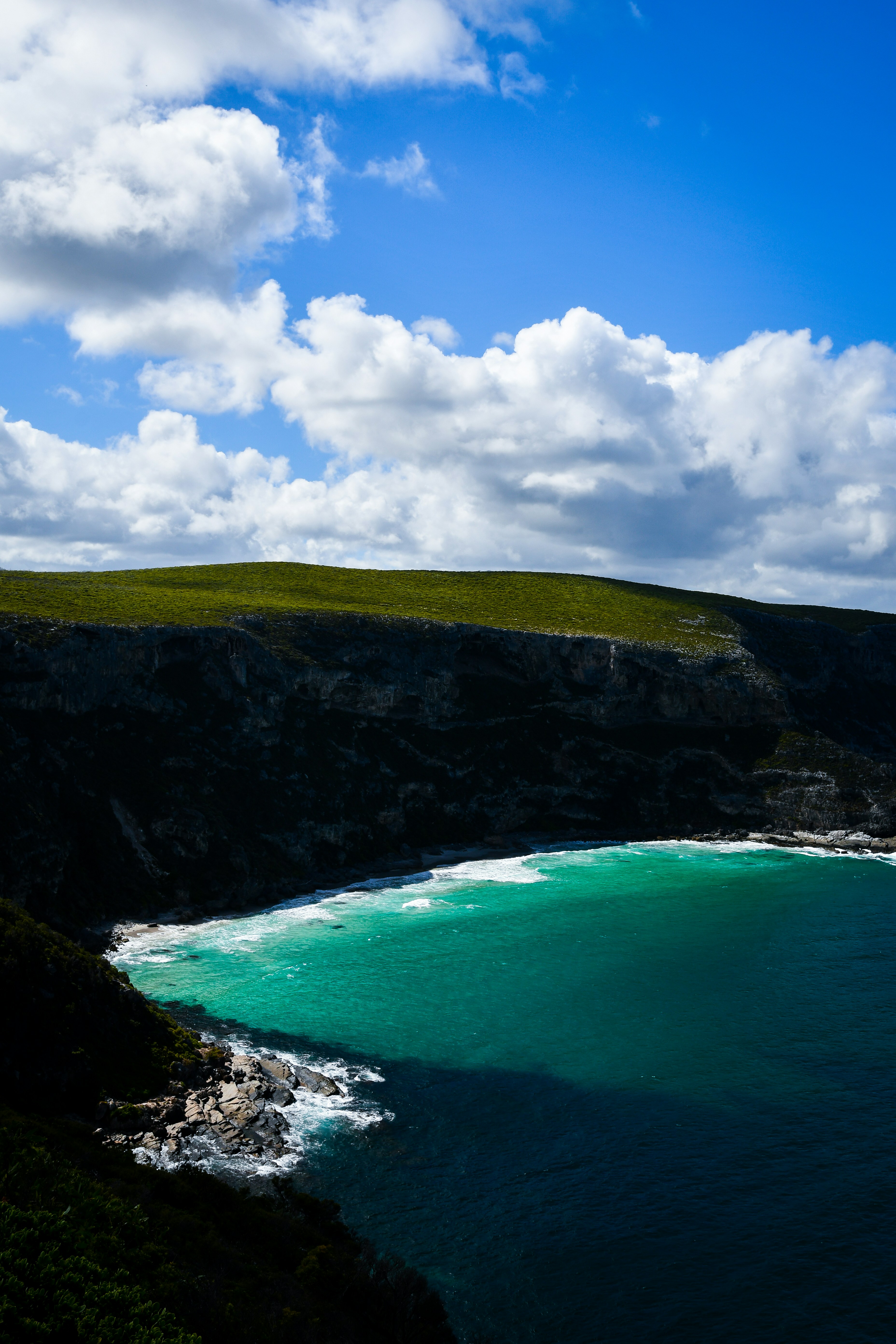Sea Cliff Edge Under Wide Sky