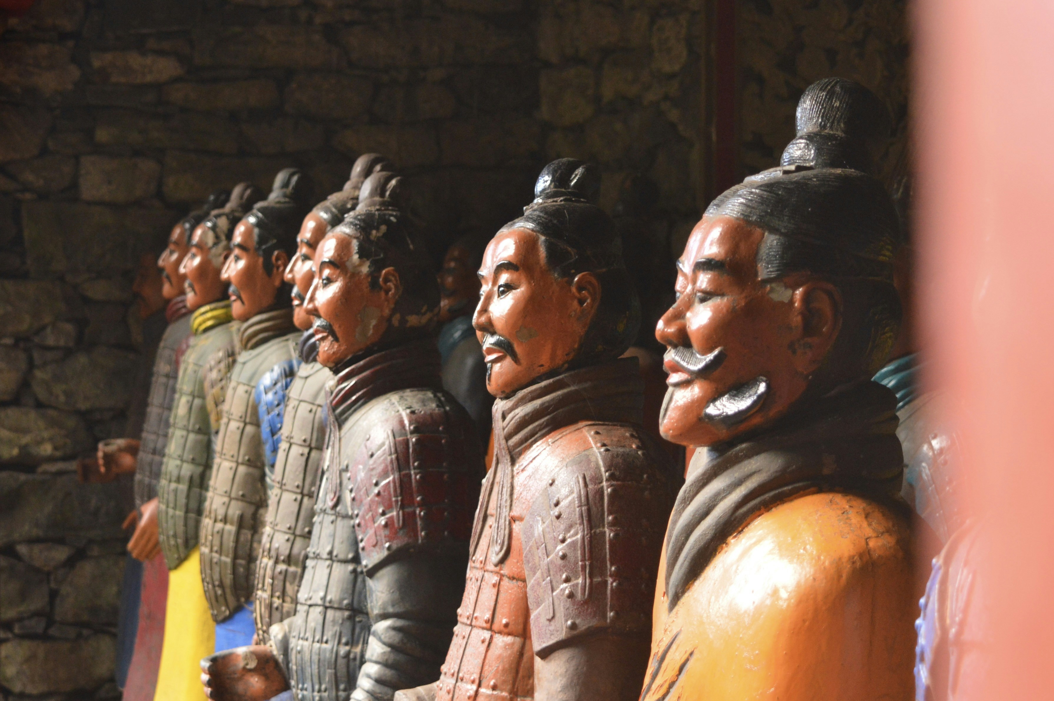Line of silent guardians: Terracotta soldiers in a sunlit gallery