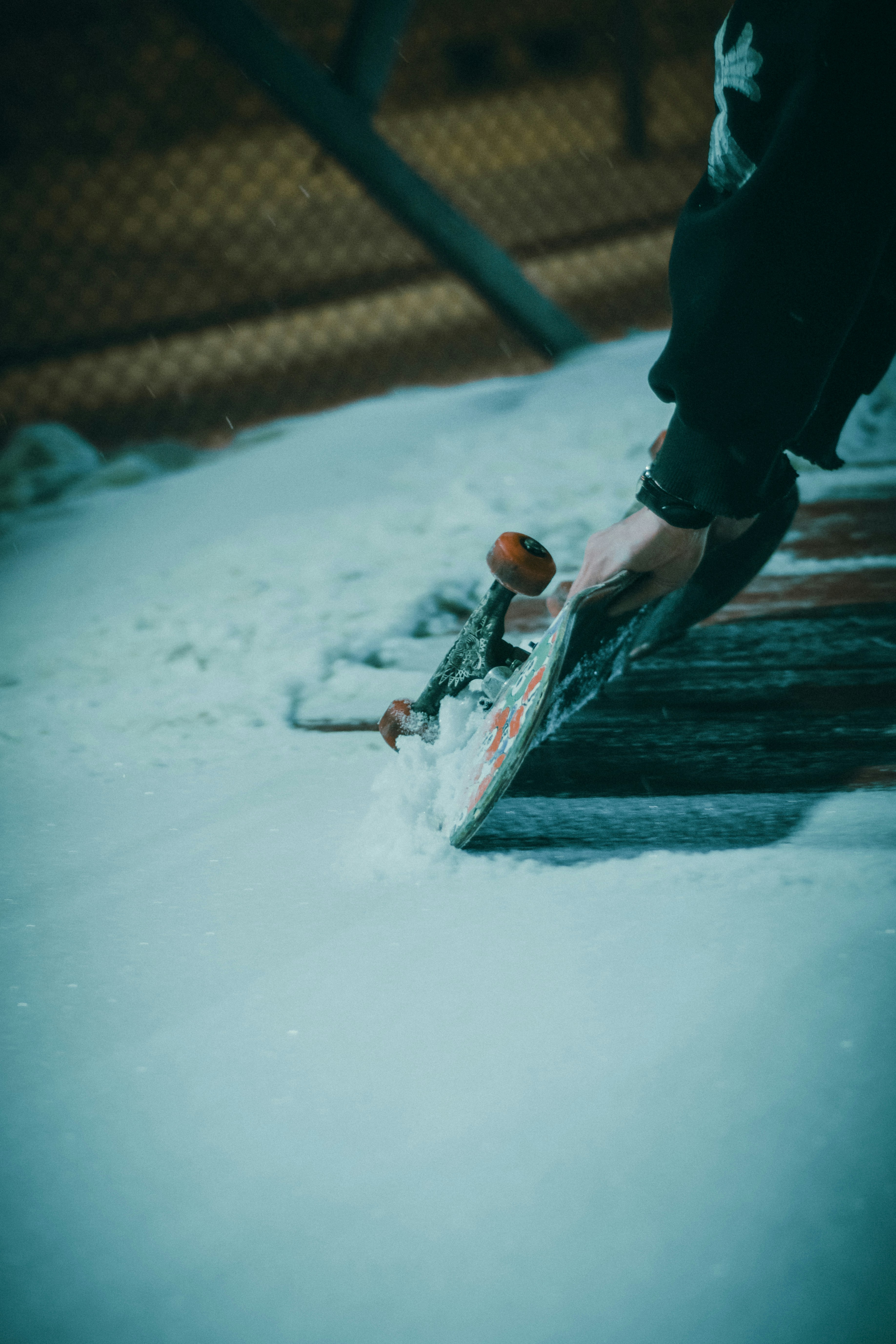 Snowy Skater: Focus on the Grimace of Control as Wheels Slice Through Frost