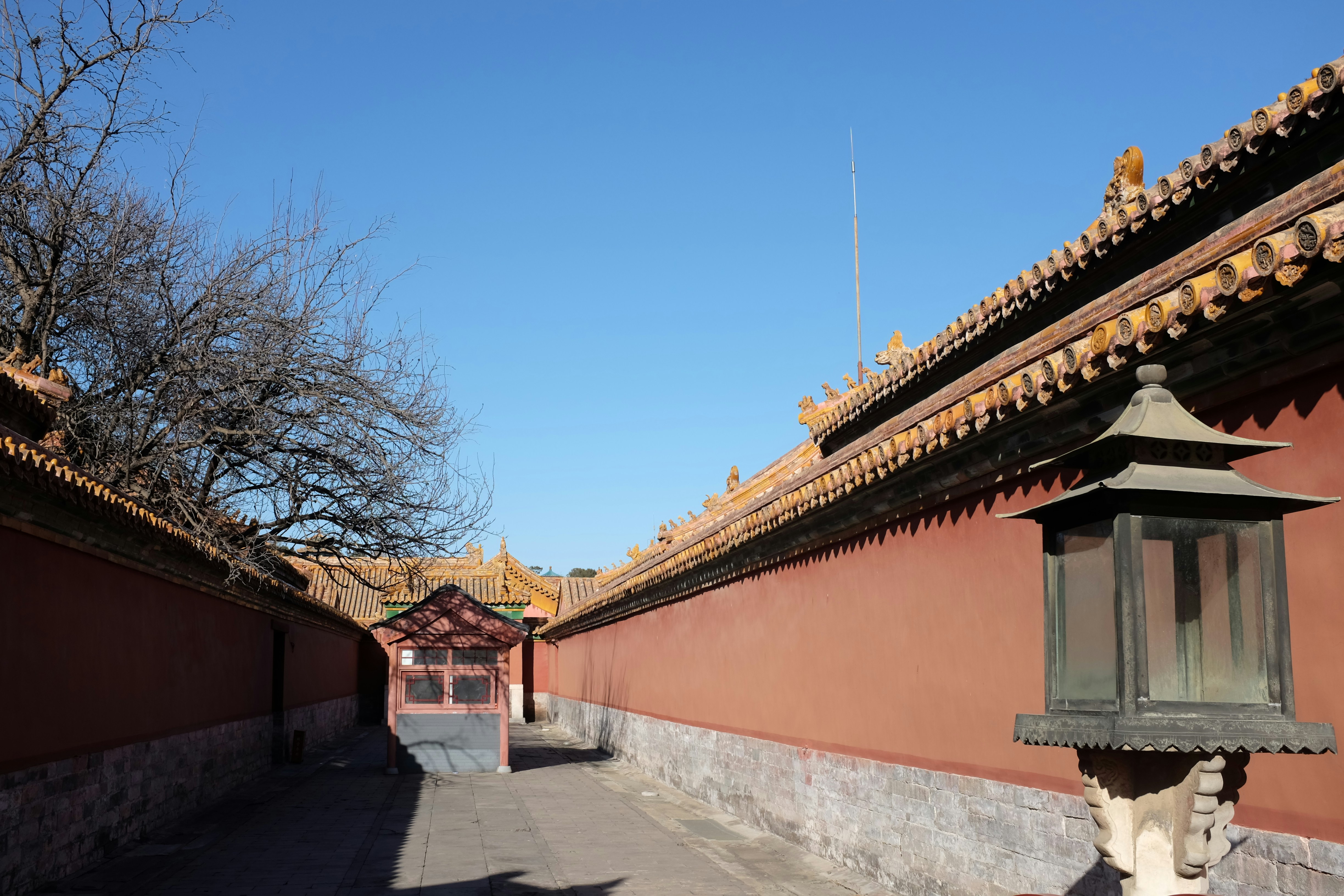 Red-walled Corridor under a Clear Blue Sky