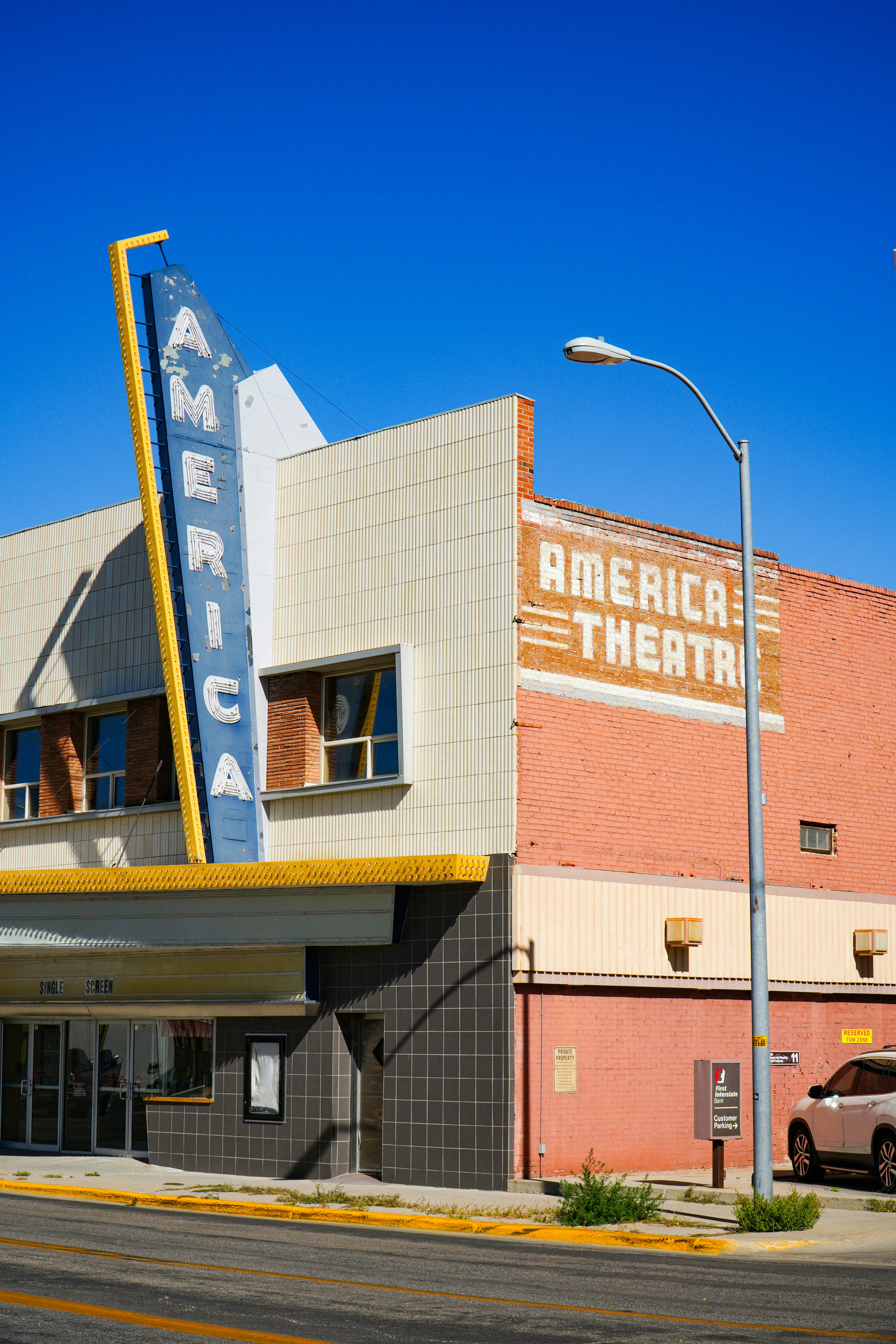 Retro Americana: Theatre Signage Silhouette Against a Clear Blue Sky
