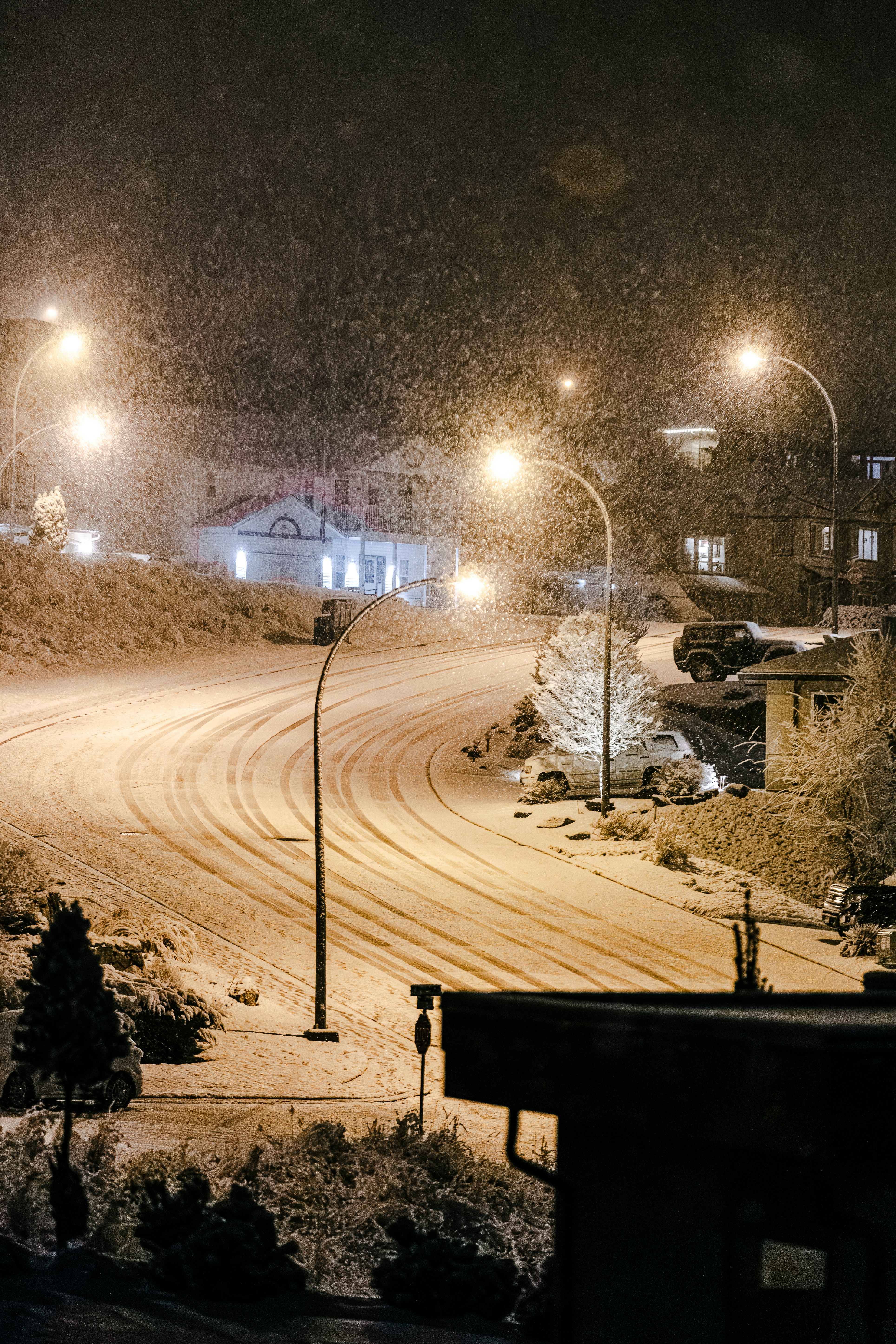 Snowlit Roundabout Serenade: Street Lamps, Snow, and Quiet Night