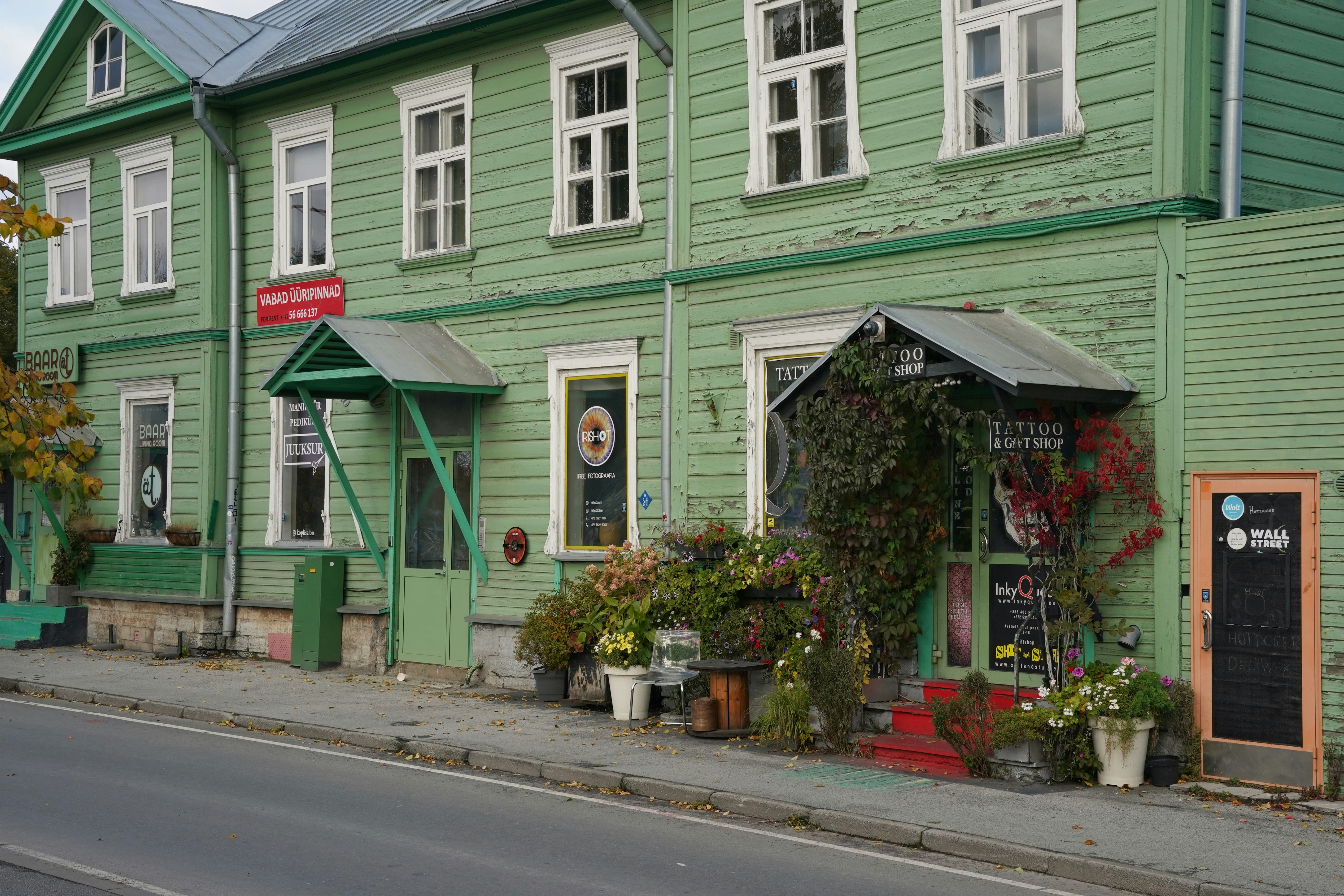 Pastel Facades and Floral Shopfronts on a Quiet Main Street