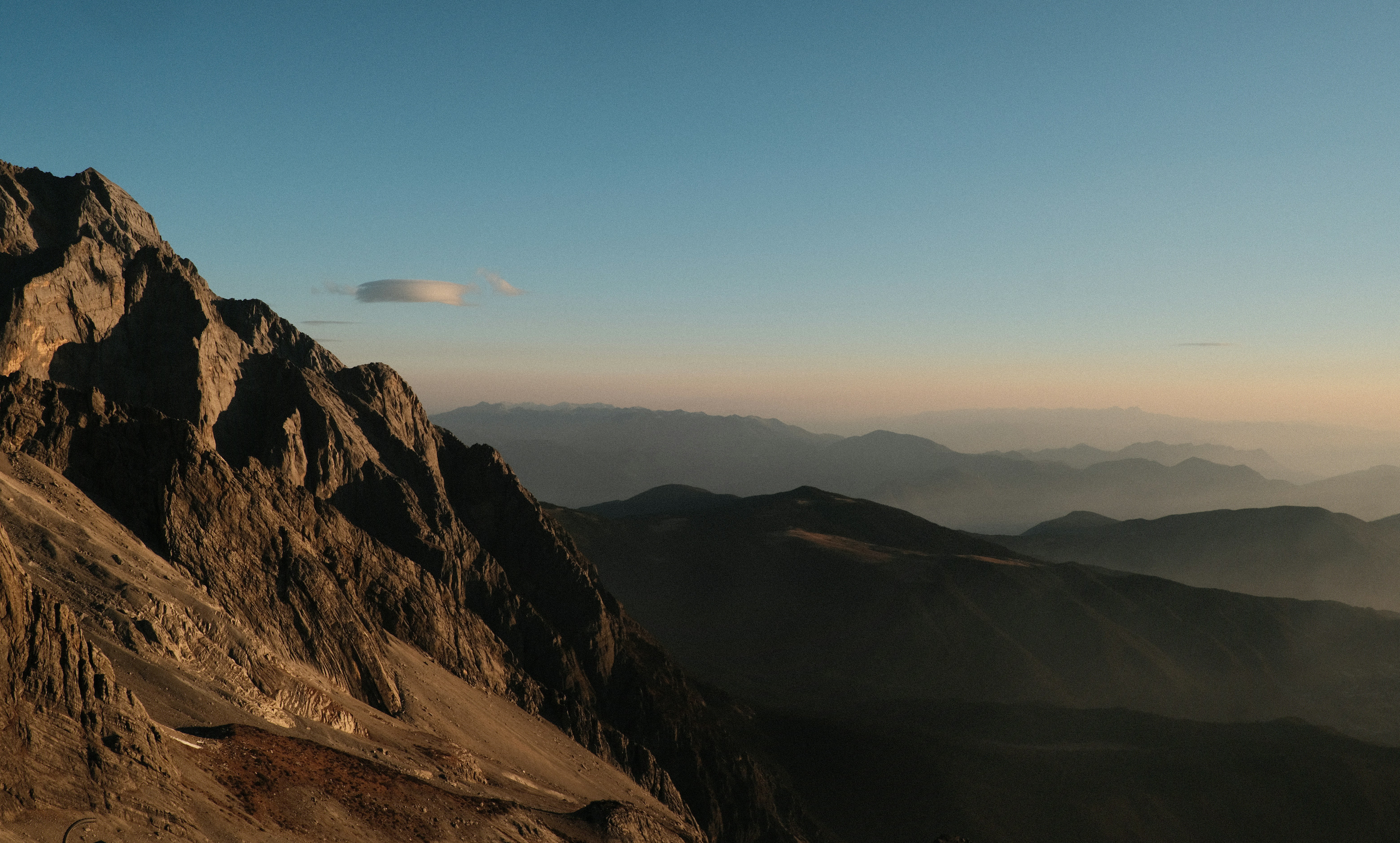 Ridge Line at Dusk: A Staircase of Silhouettes over the Valley