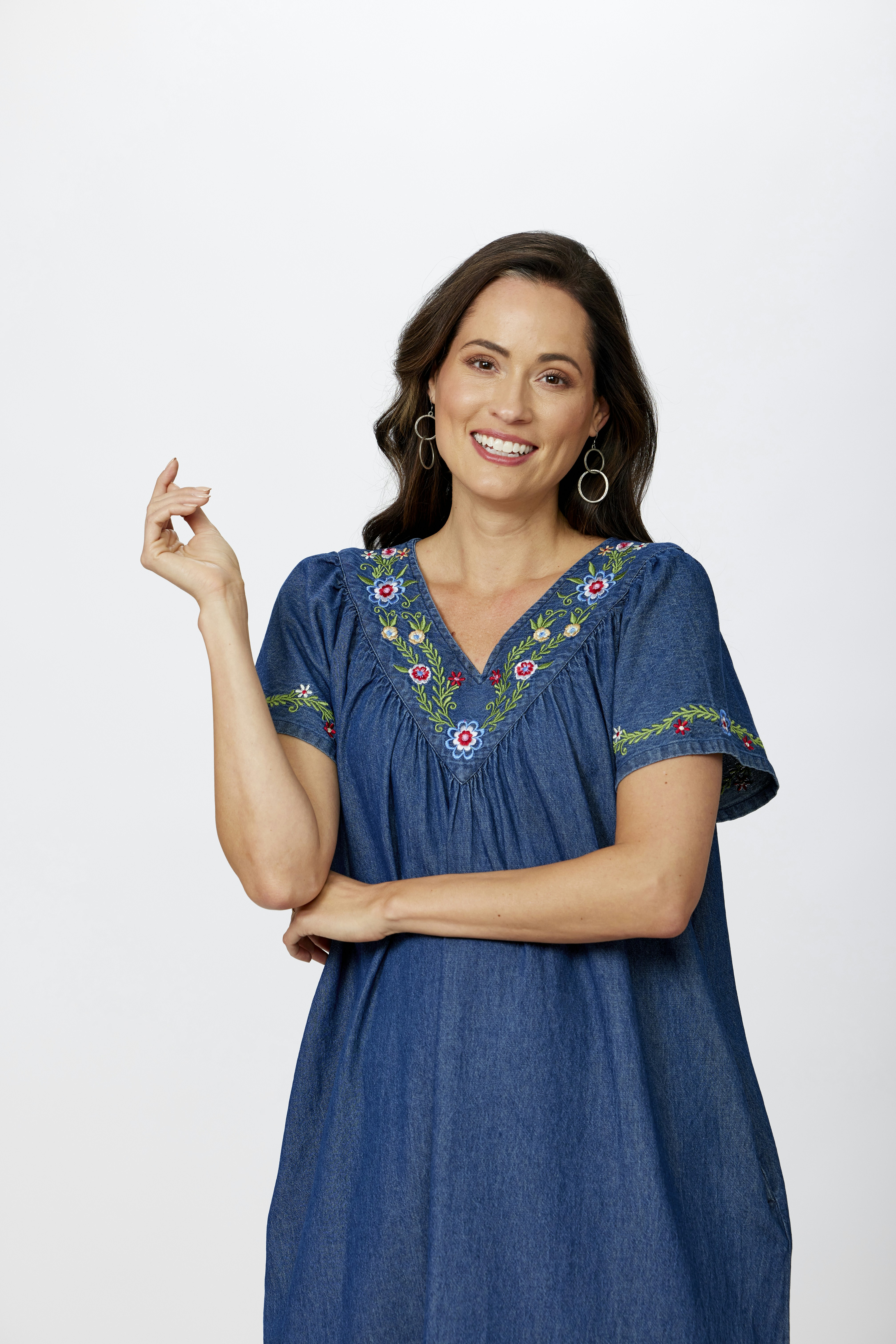 Blue Embroidered Dress: Confident Smile Under Floral Neckline