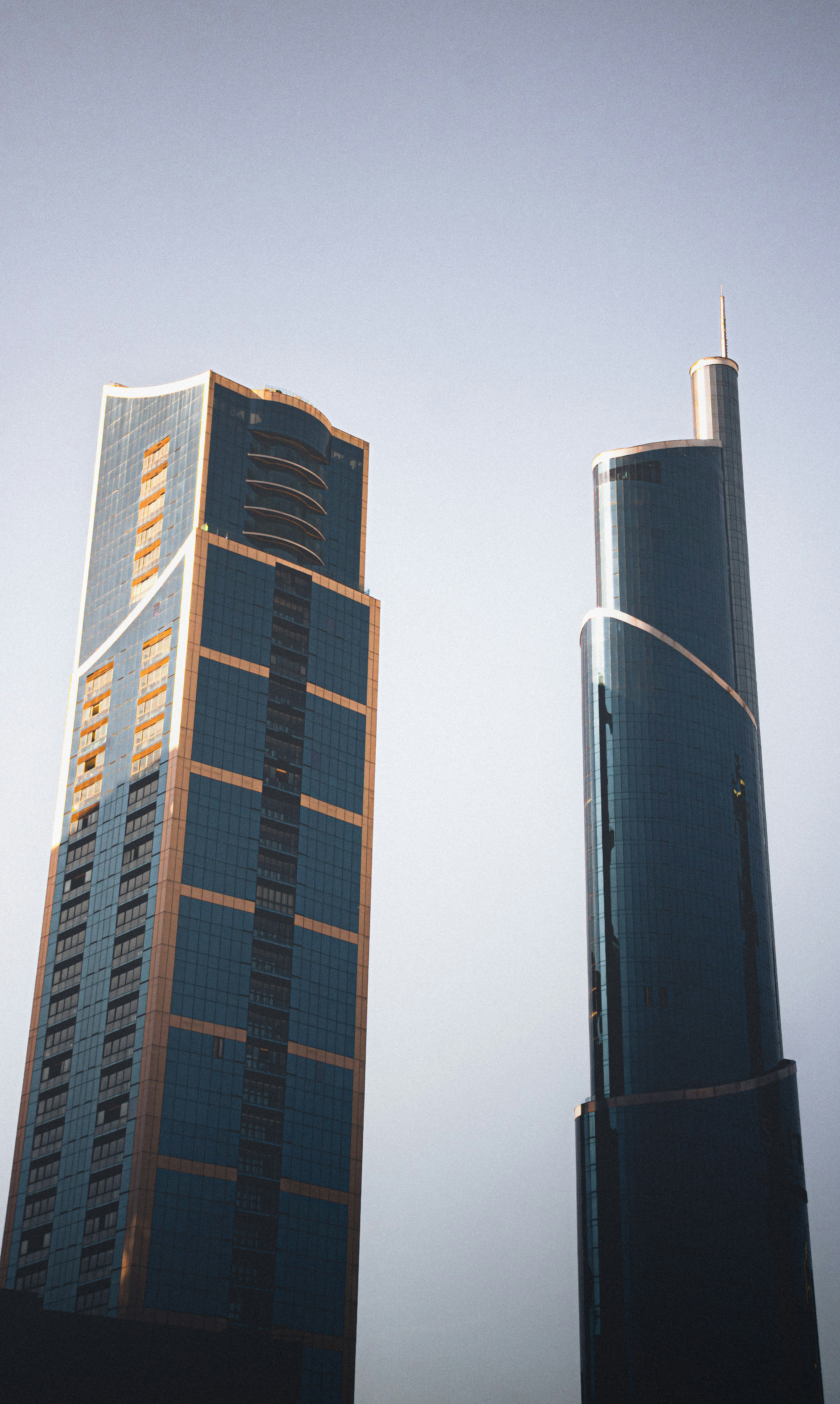 Twin Spires of Steel: A cityscape with opposing glass towers